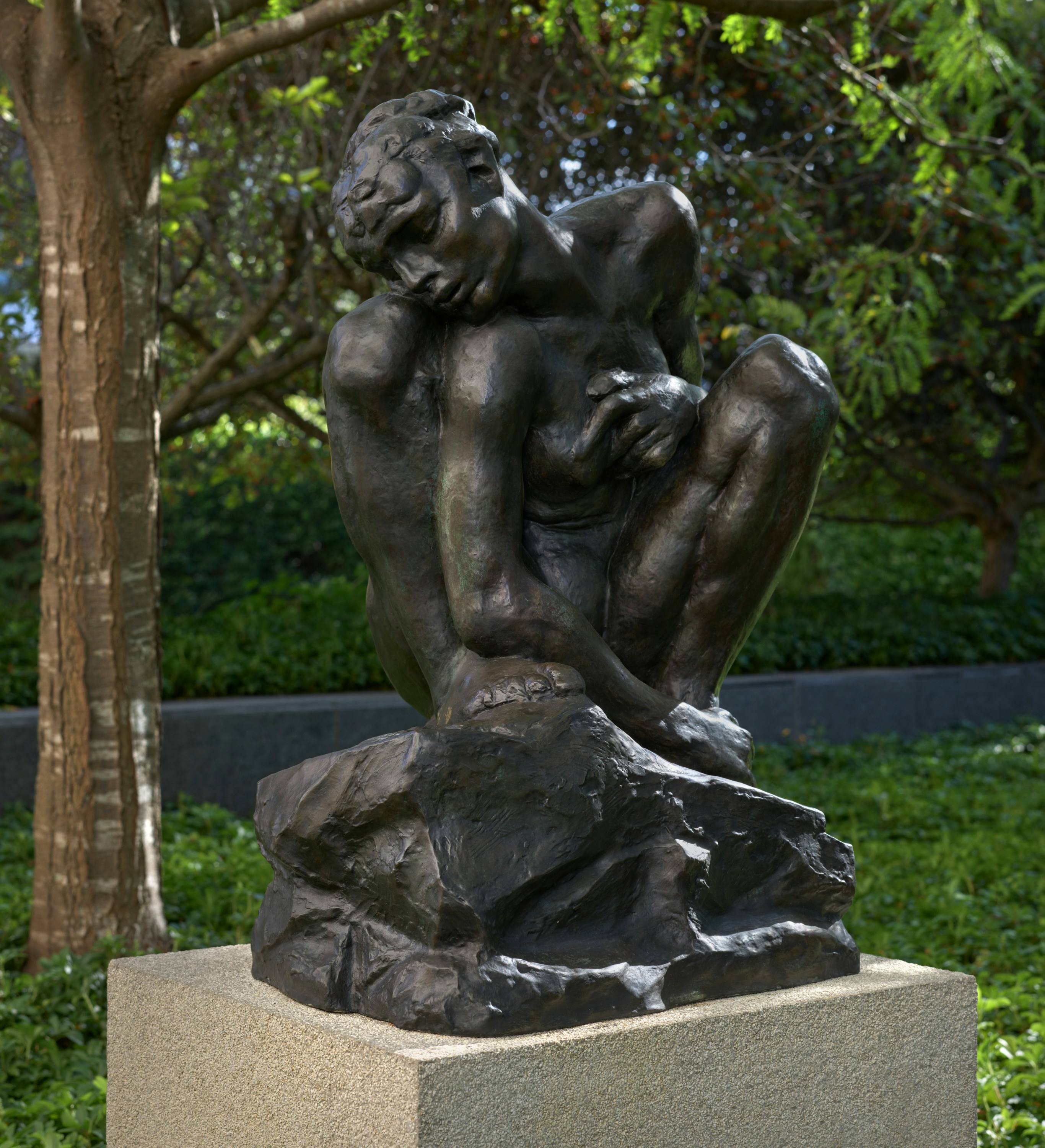 Contemplative Bronze: The Knotted Pose of a Seated Figure