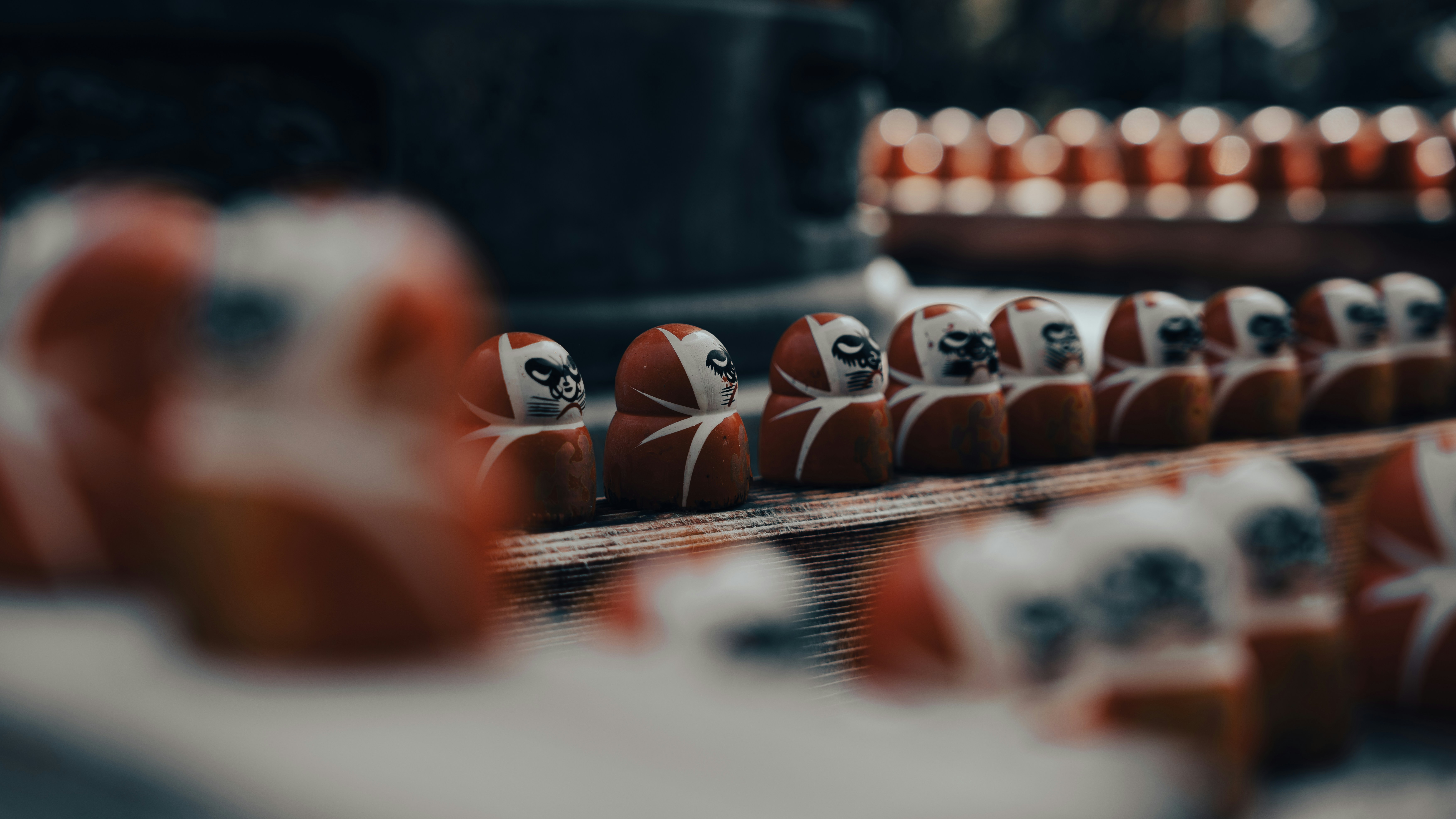 Row of cinnamon-colored rooks: a shallow-focus chessboard of pint-sized pastries