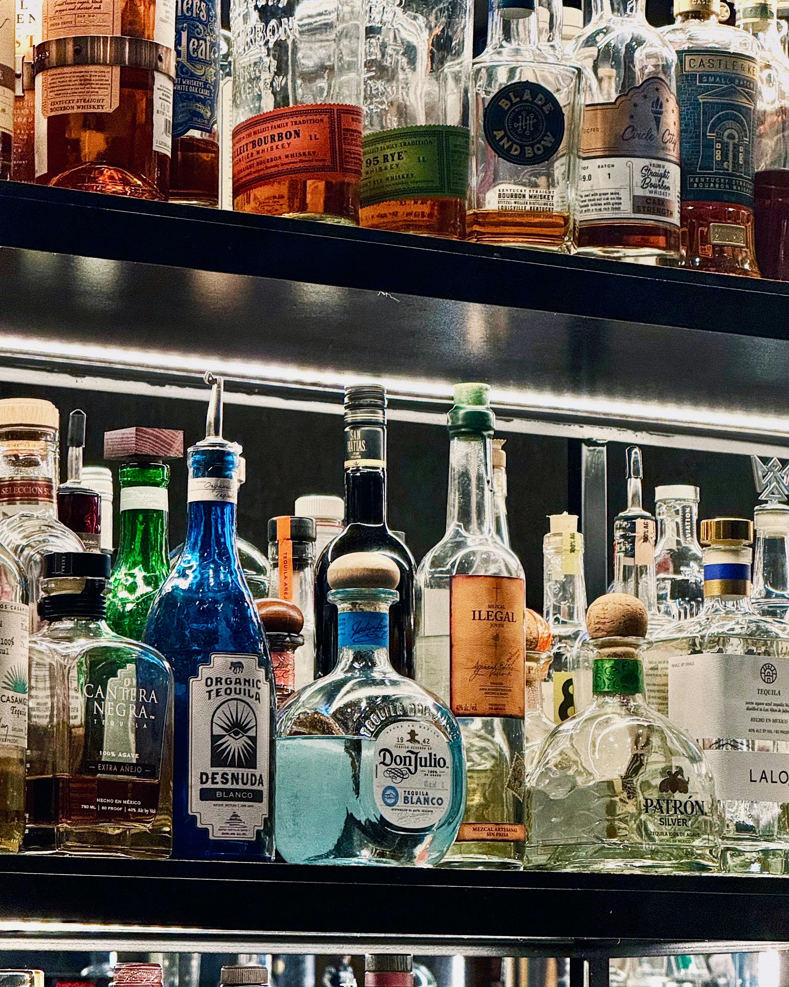 Glass and Ghosts on a Neon Shelf