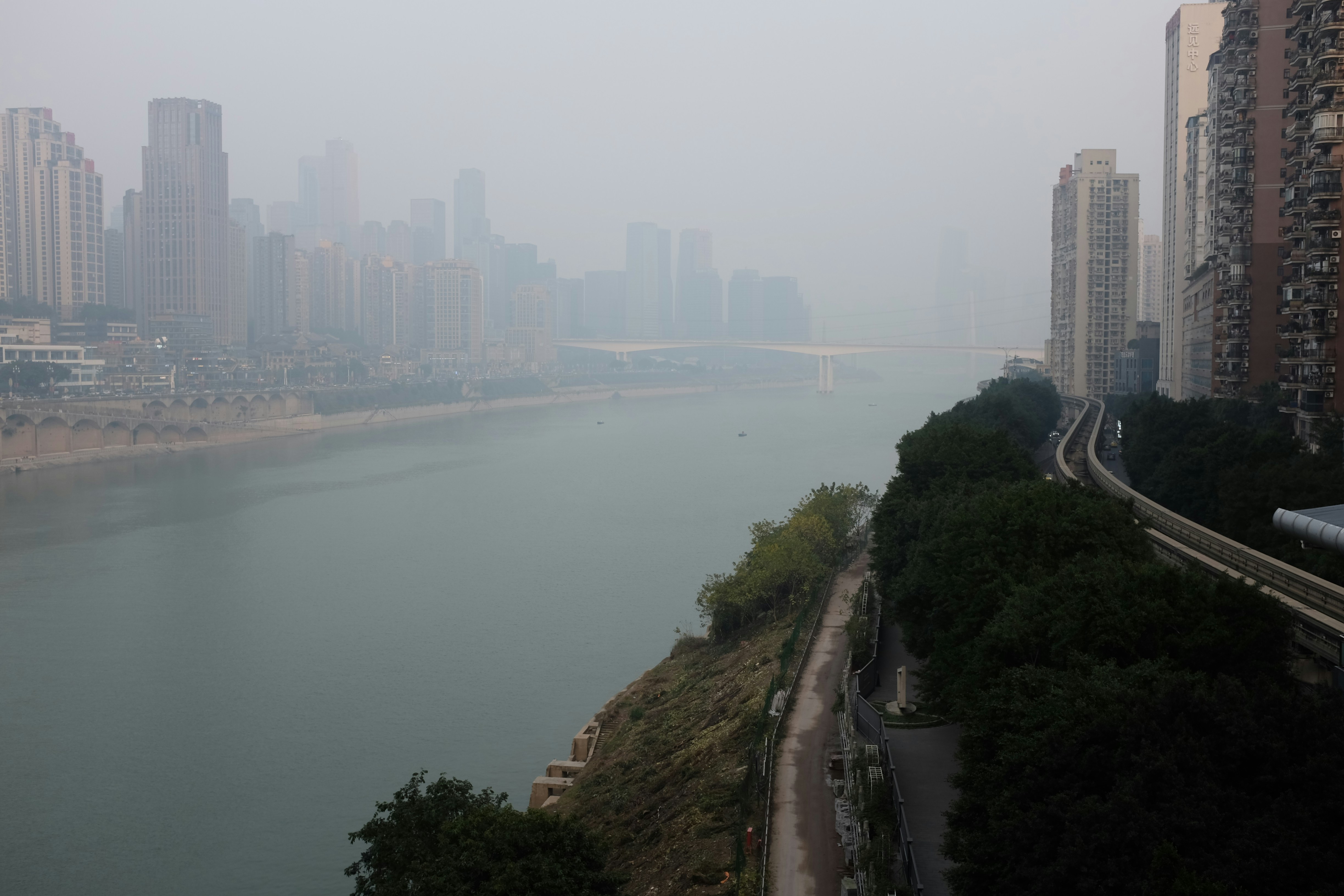Mist Over the River Edge: A Corridor of City Light