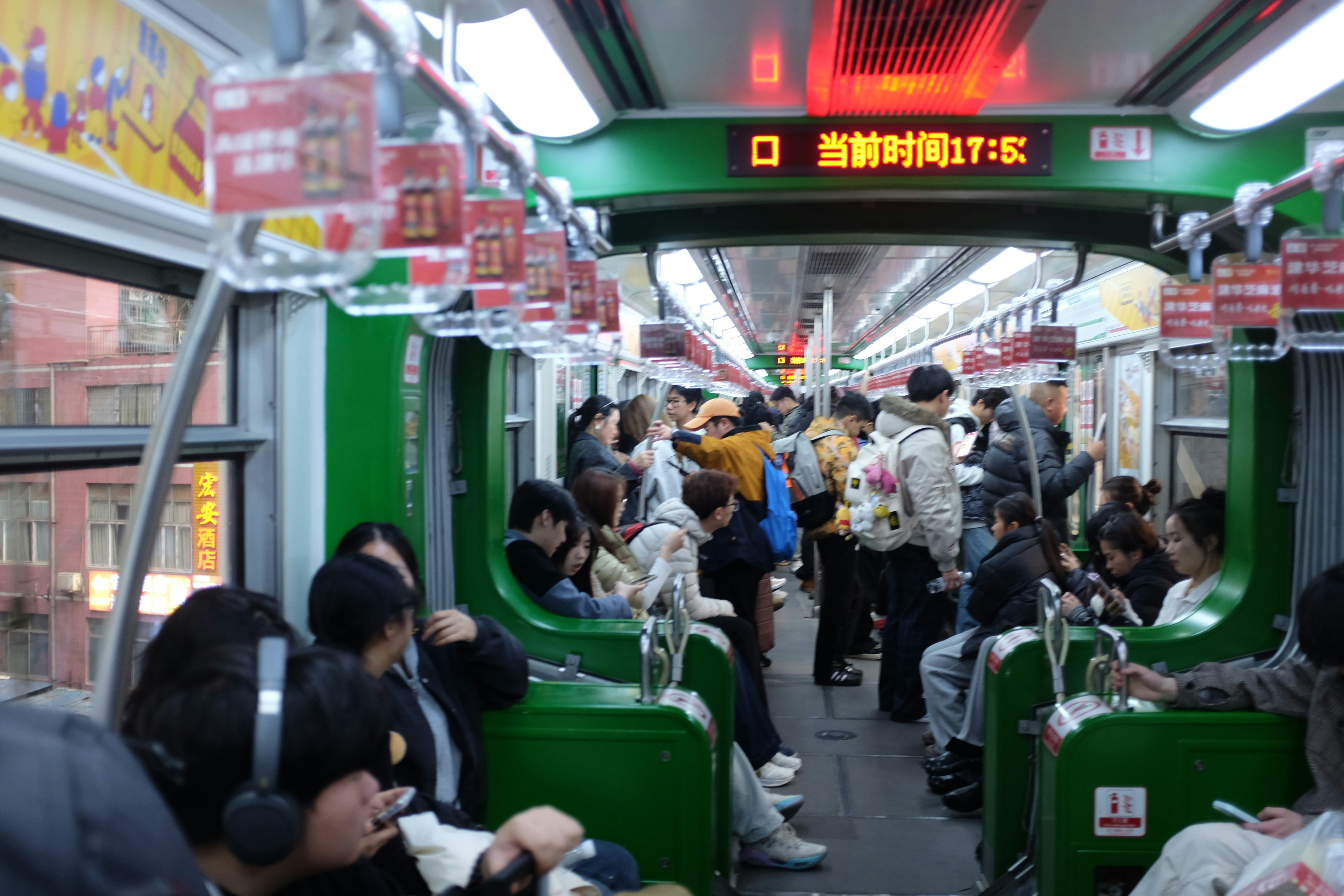 Crowded Shanghai Metro Car: Shared Silence Amid Headphones and Hushed Conversations