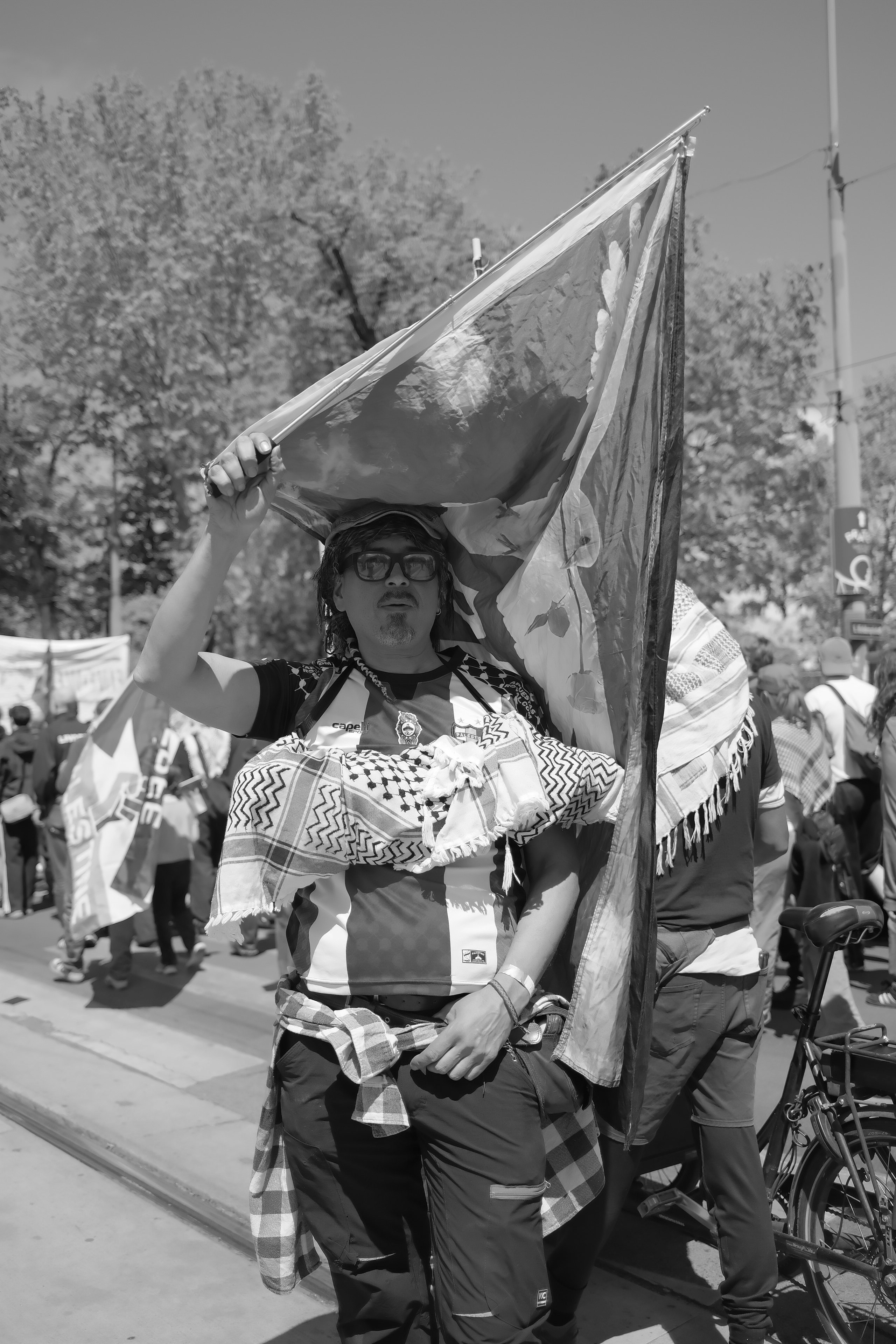 Banner Bearer in the Street: A Cultural Parade Portrait