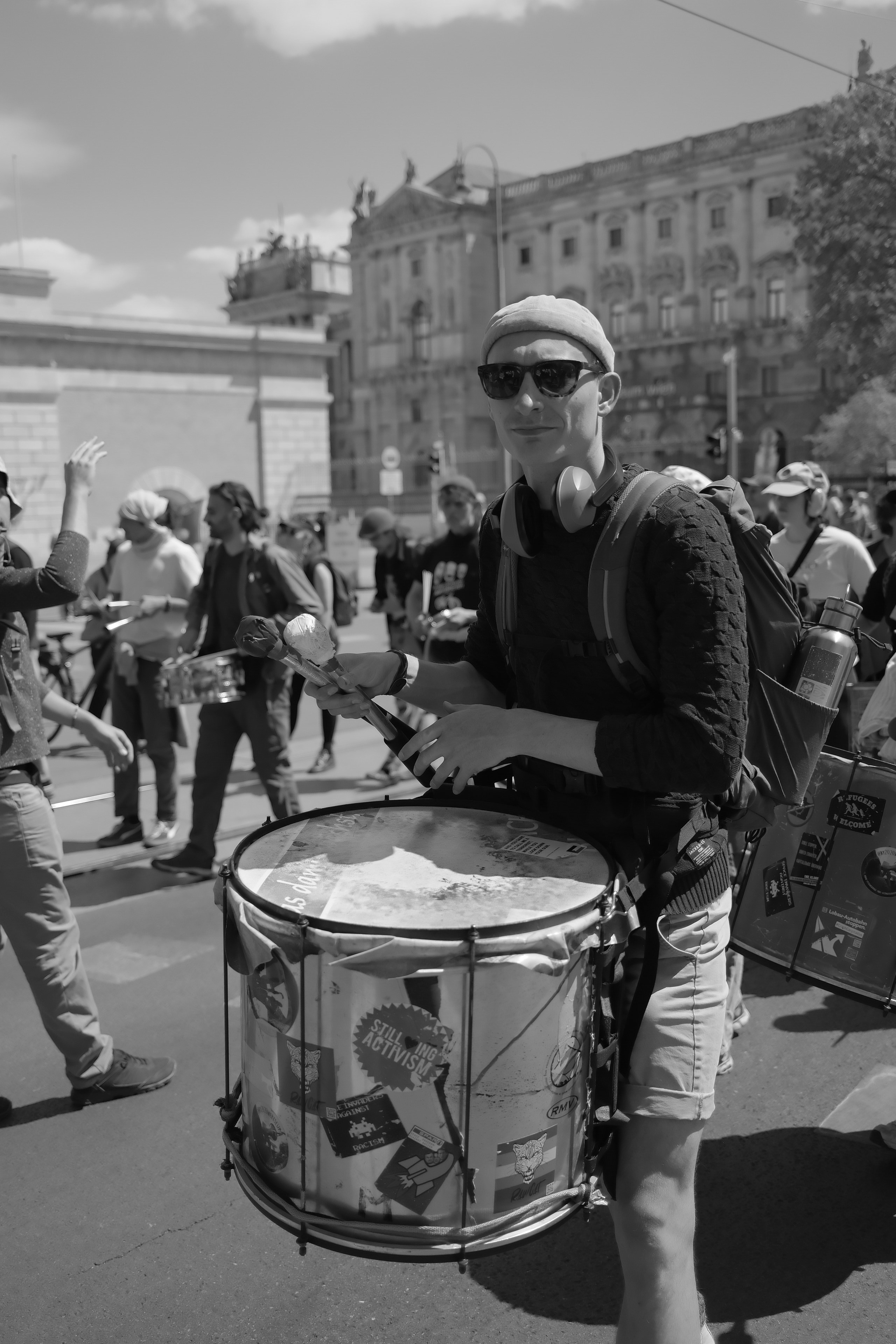 Marching to the Beat: A Street Drummer in the Crowd