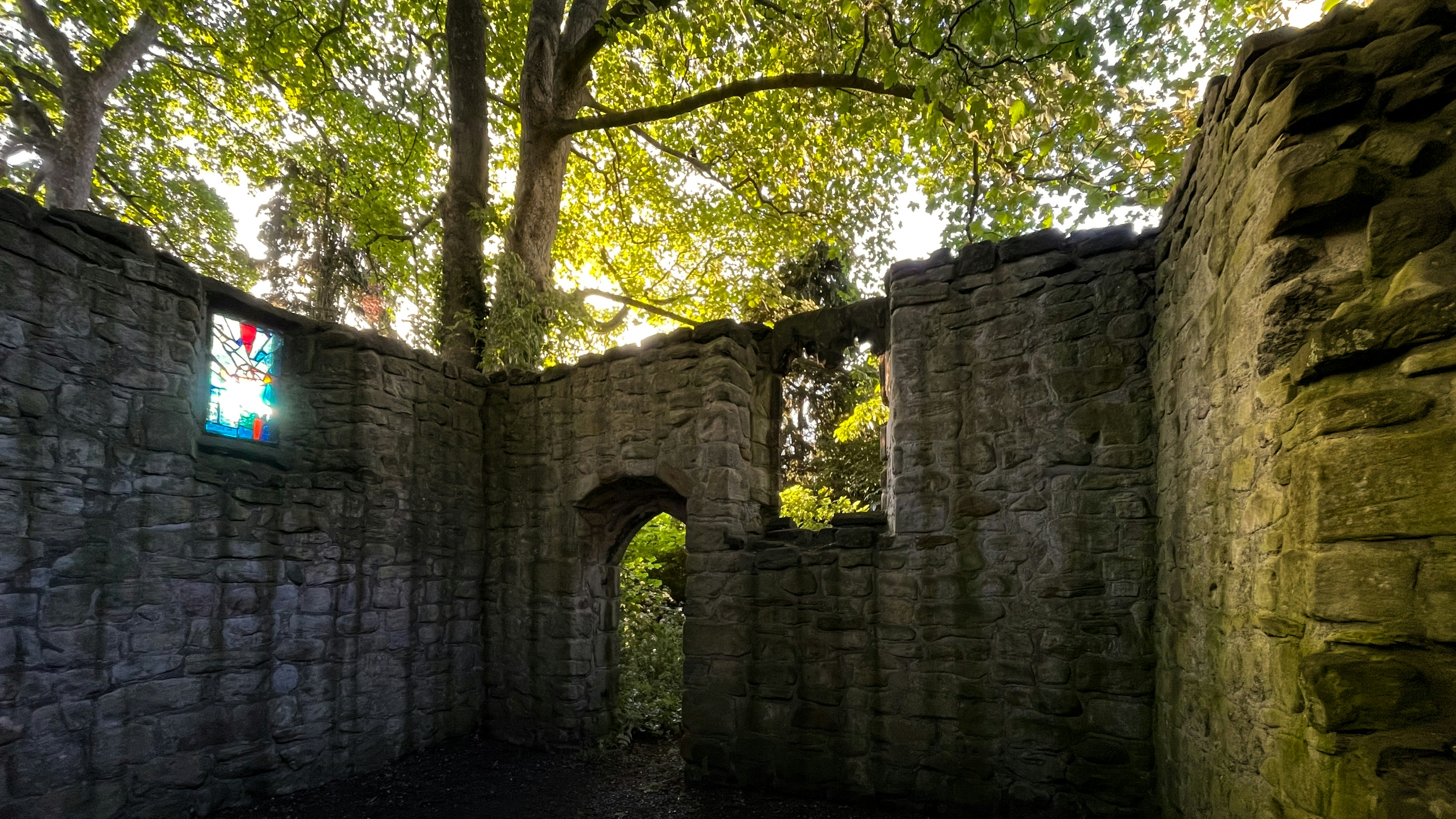 Sunlit Archway Through Ancient Stone Ruins