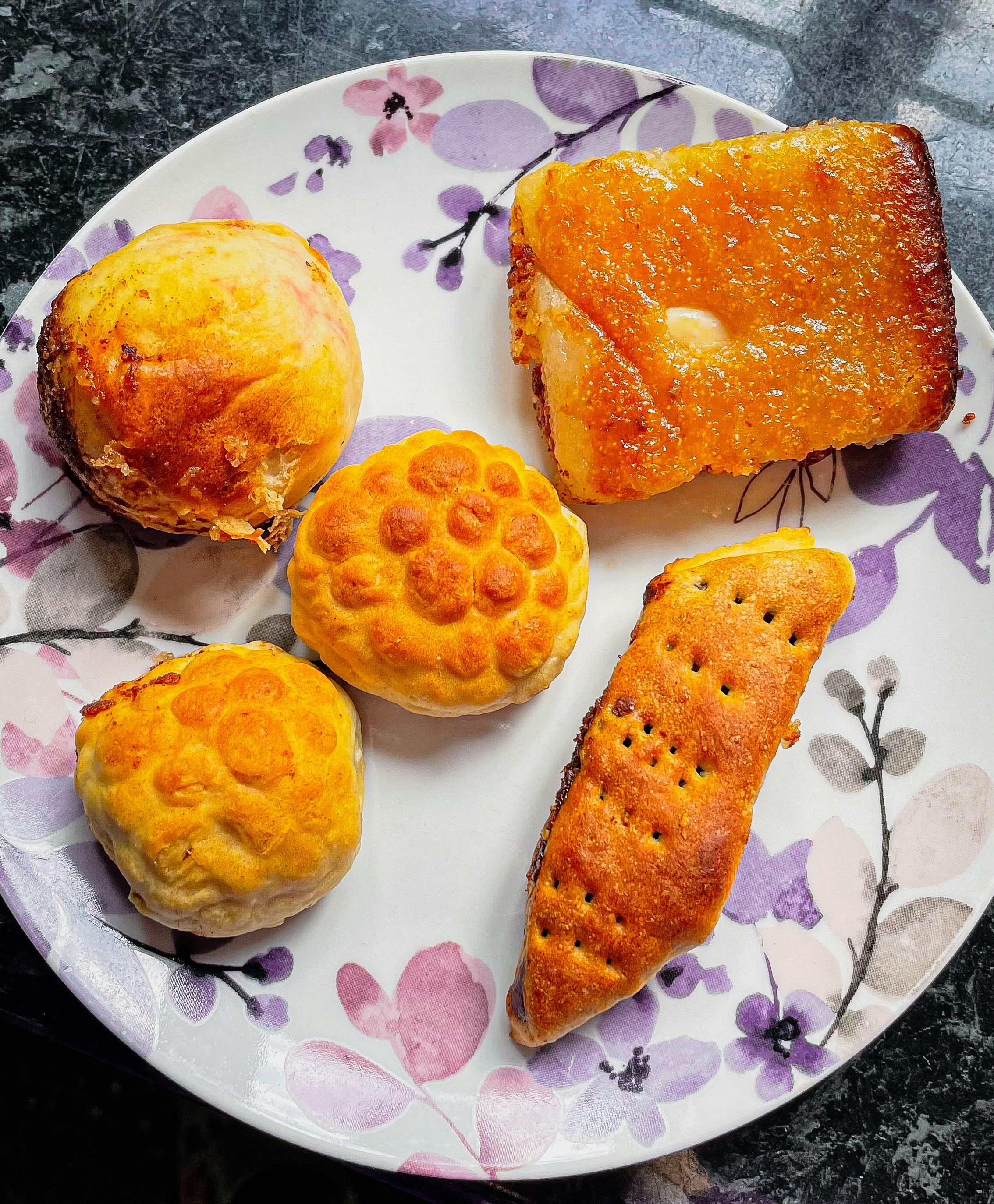 Golden Pastry Parade on a Floral Plate