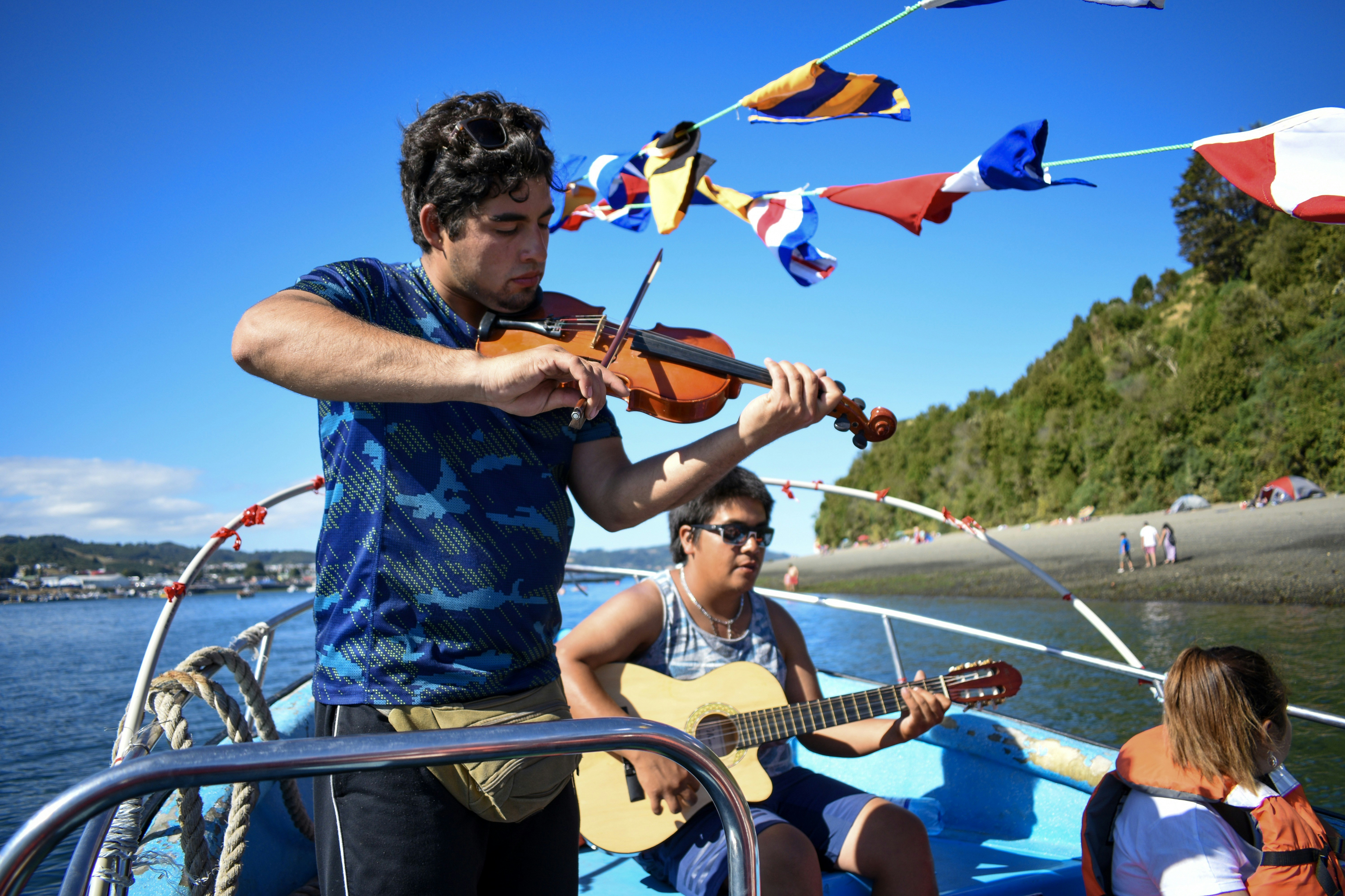 Violin Strings and Guitar Strings: A Sunlit Serenade on the Water