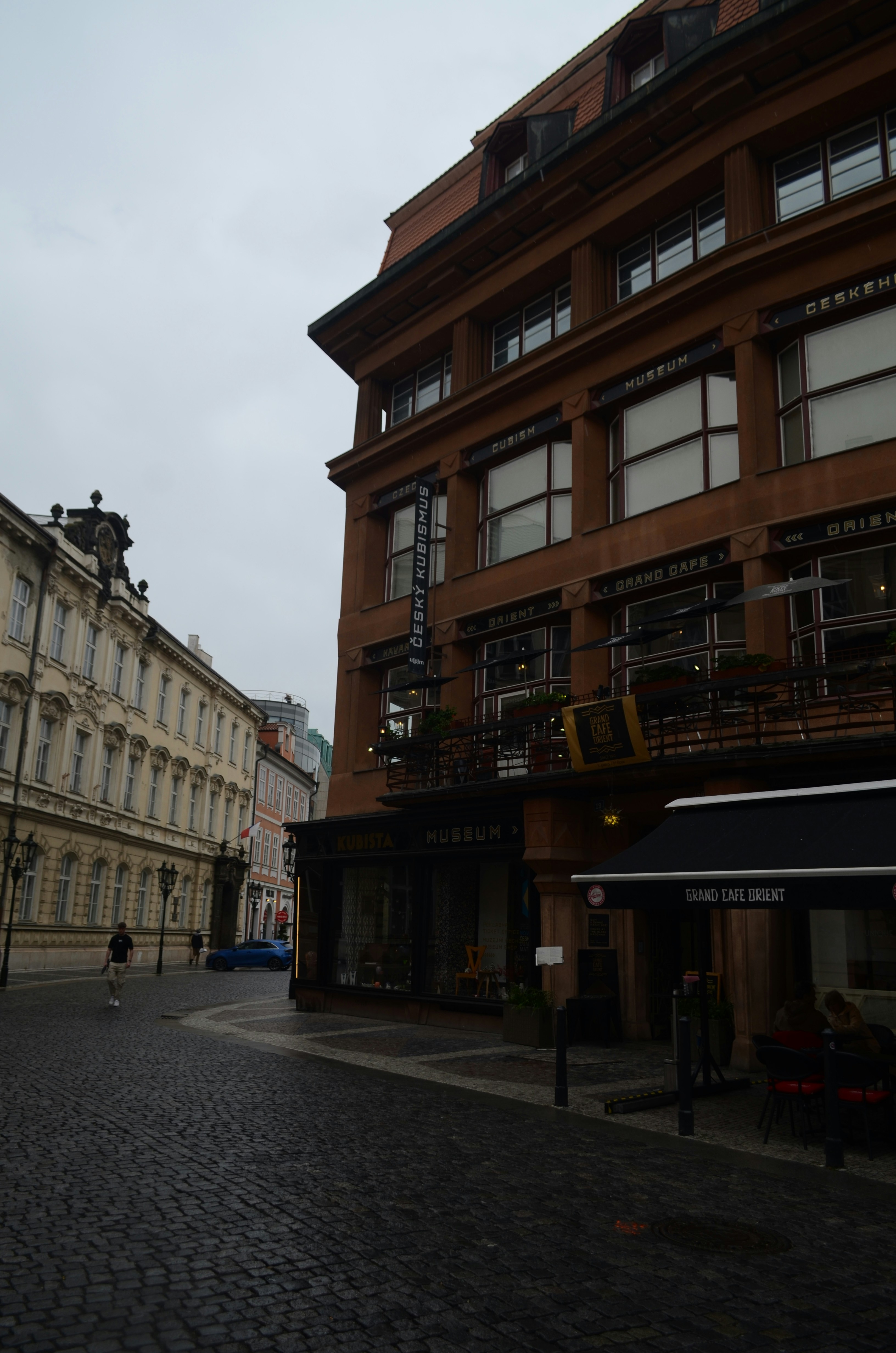 Corner Café and Museum: Historic Street Rising from Cobblestones