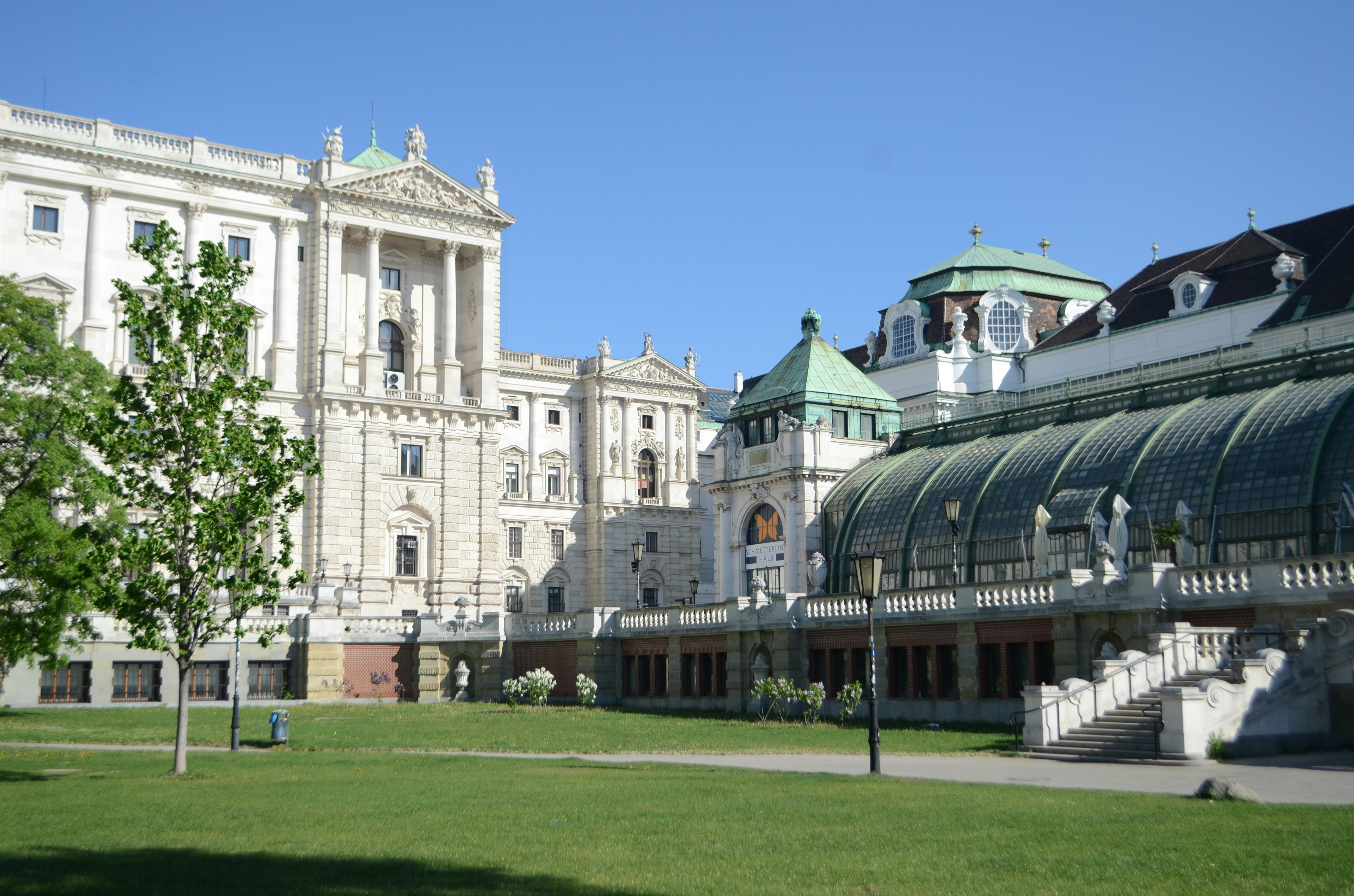 Classical Facade and Conservatory: Sunlit Symmetry of a European Palace