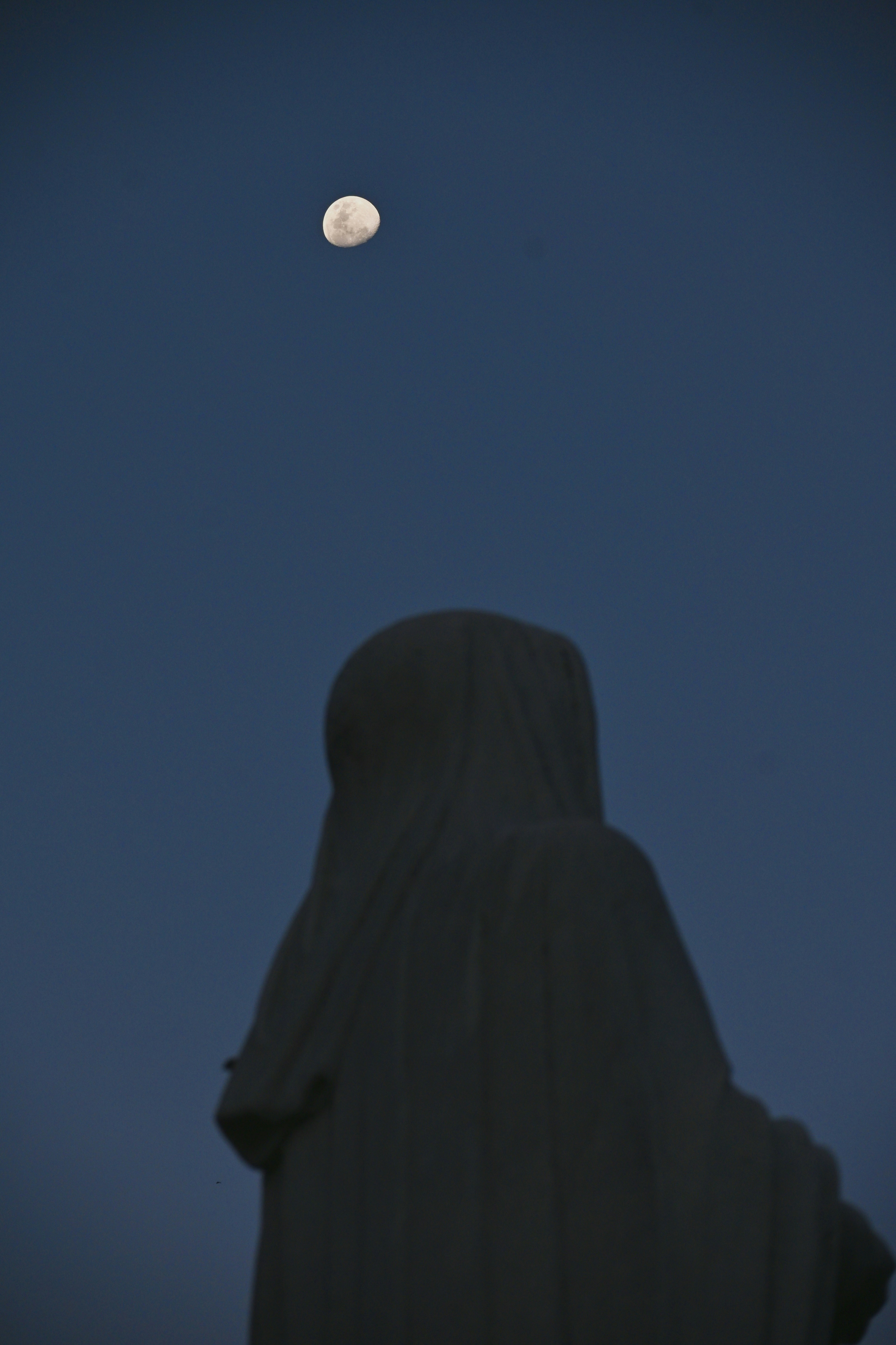 Moon Above a Quiet Monolith: Nightscape with a Statue Silhouette
