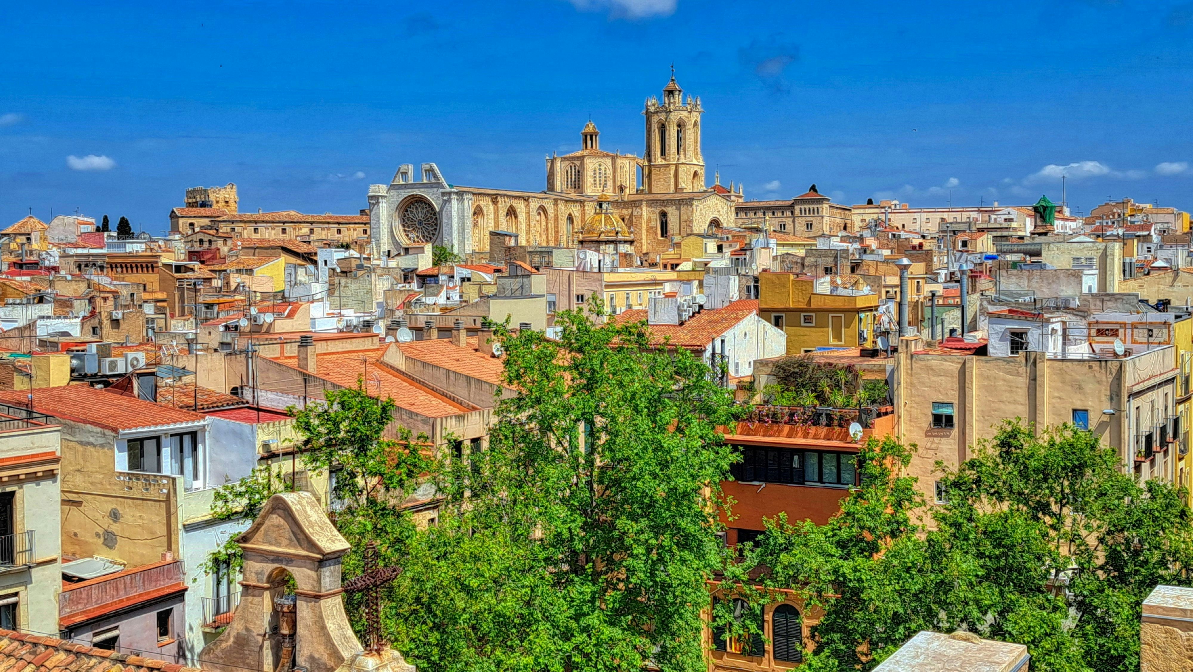 Rooftop Choir: A Mediterranean Cityscape Under Clear Noon Light