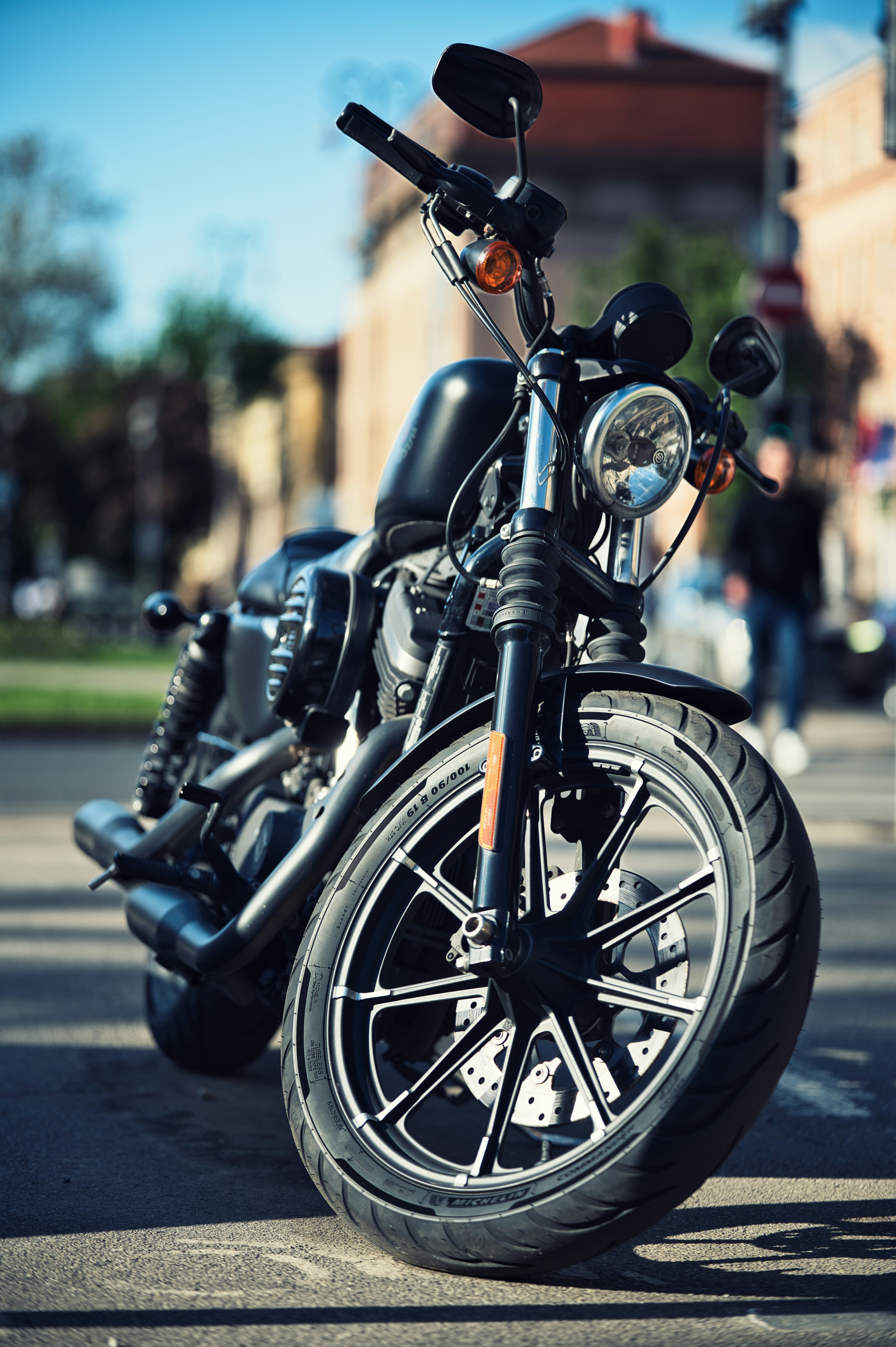Midnight Chrome: A Motorcycle Leaning into the Streetlight Glow