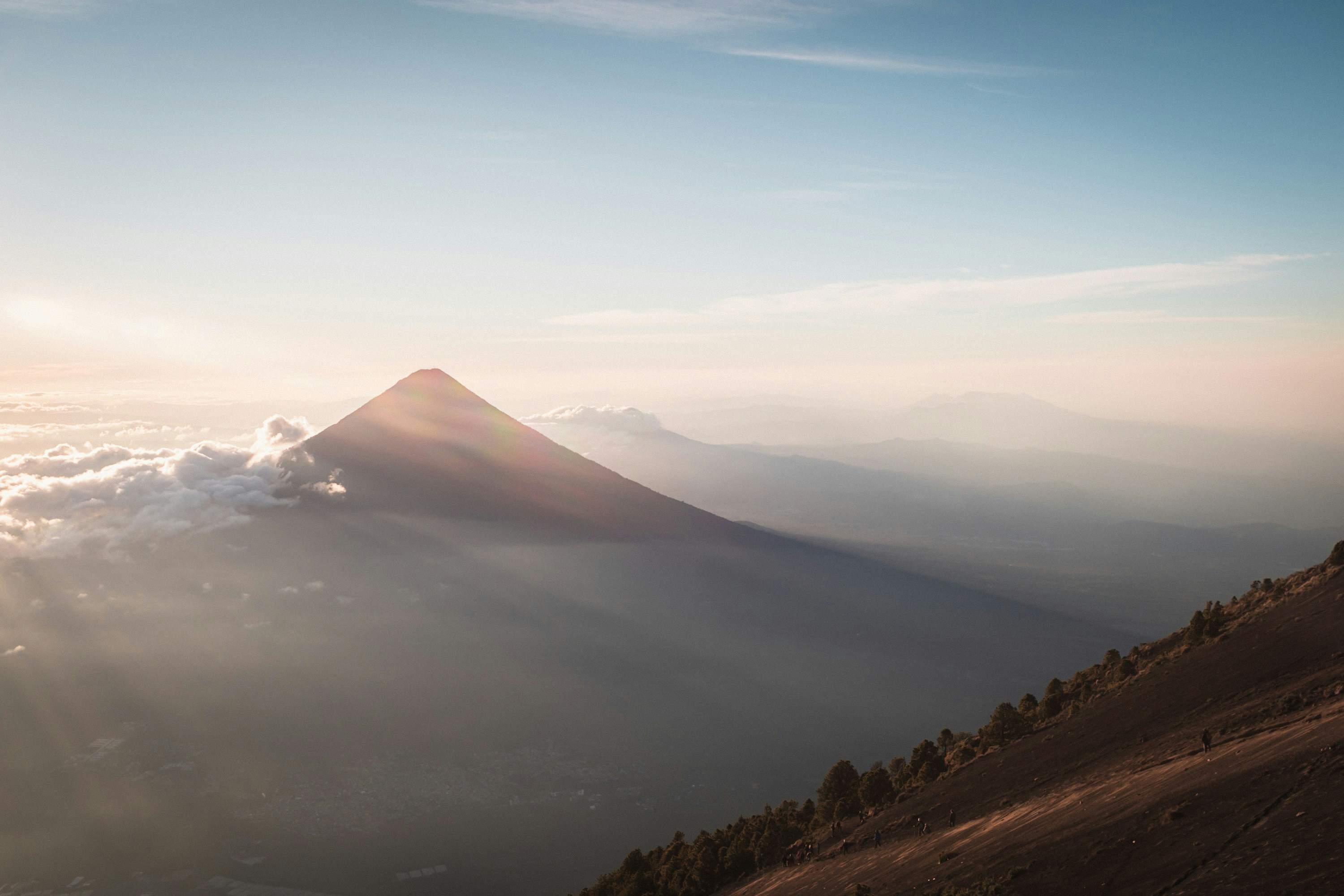 Sunlit Summit: A Gentle Ridge and a Lunar Peak