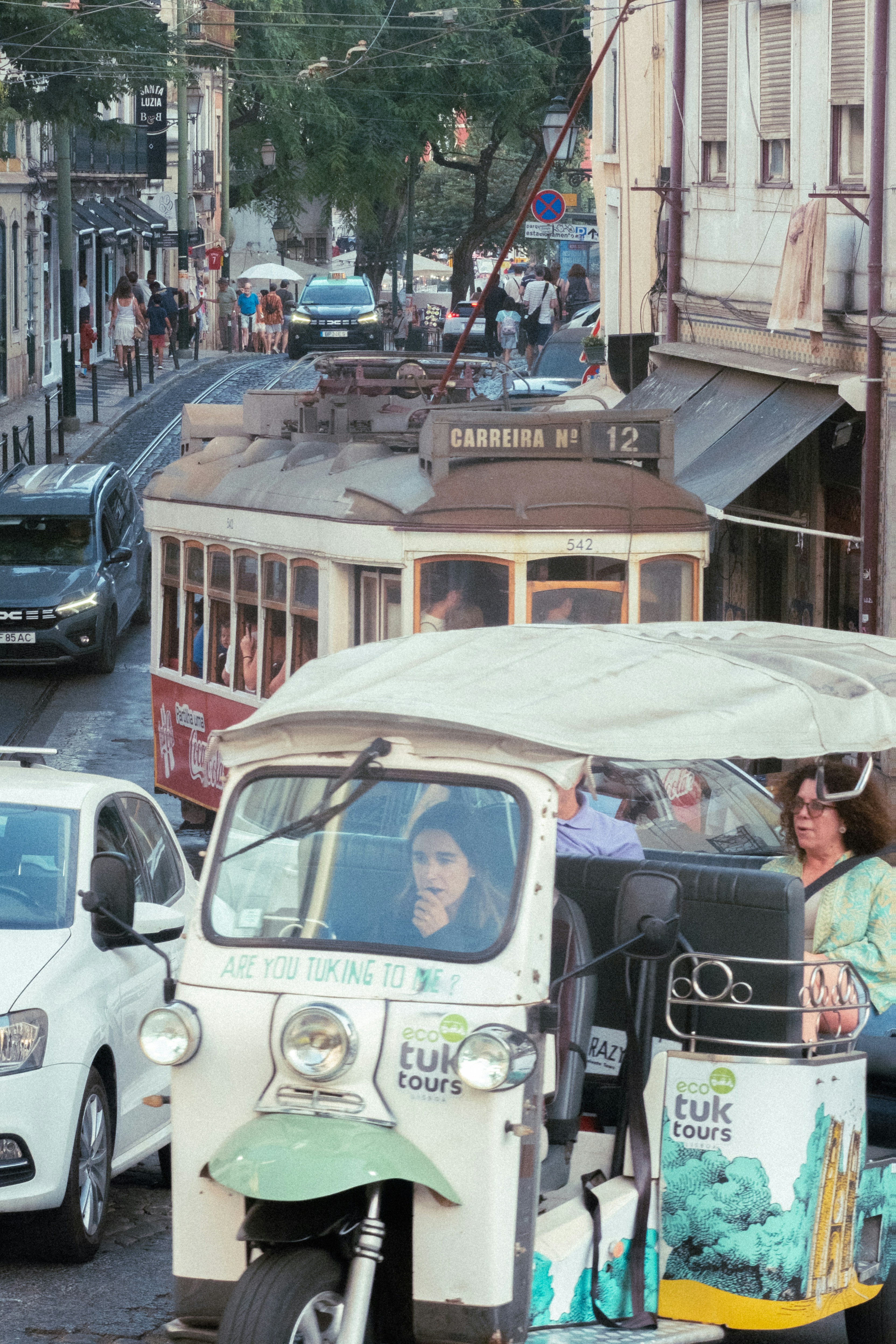 Trolley Times: A Busy Urban Street Layered with Vehicles and Pedestrians