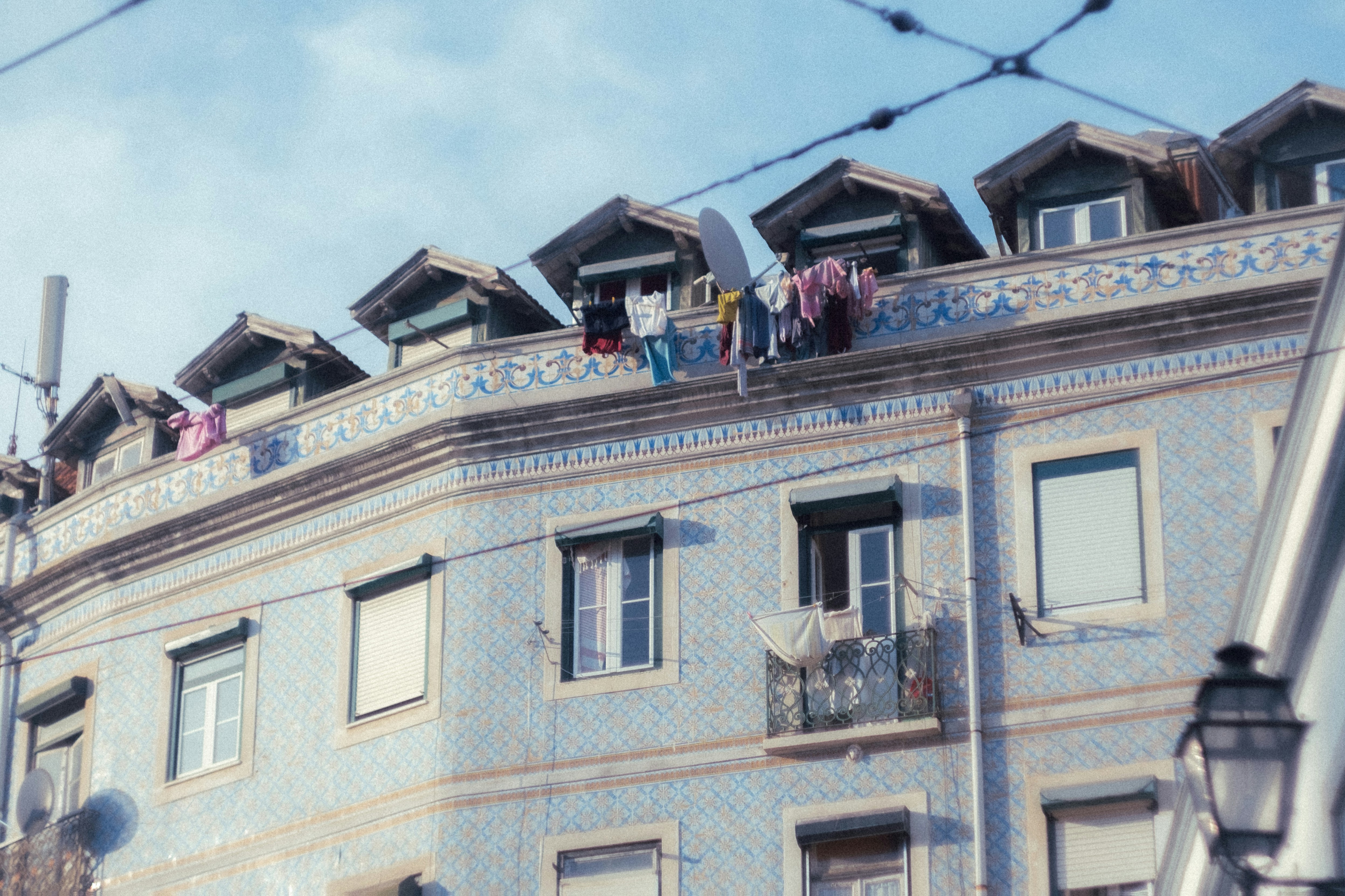 Apartment Facade with Laundry on the Roofline