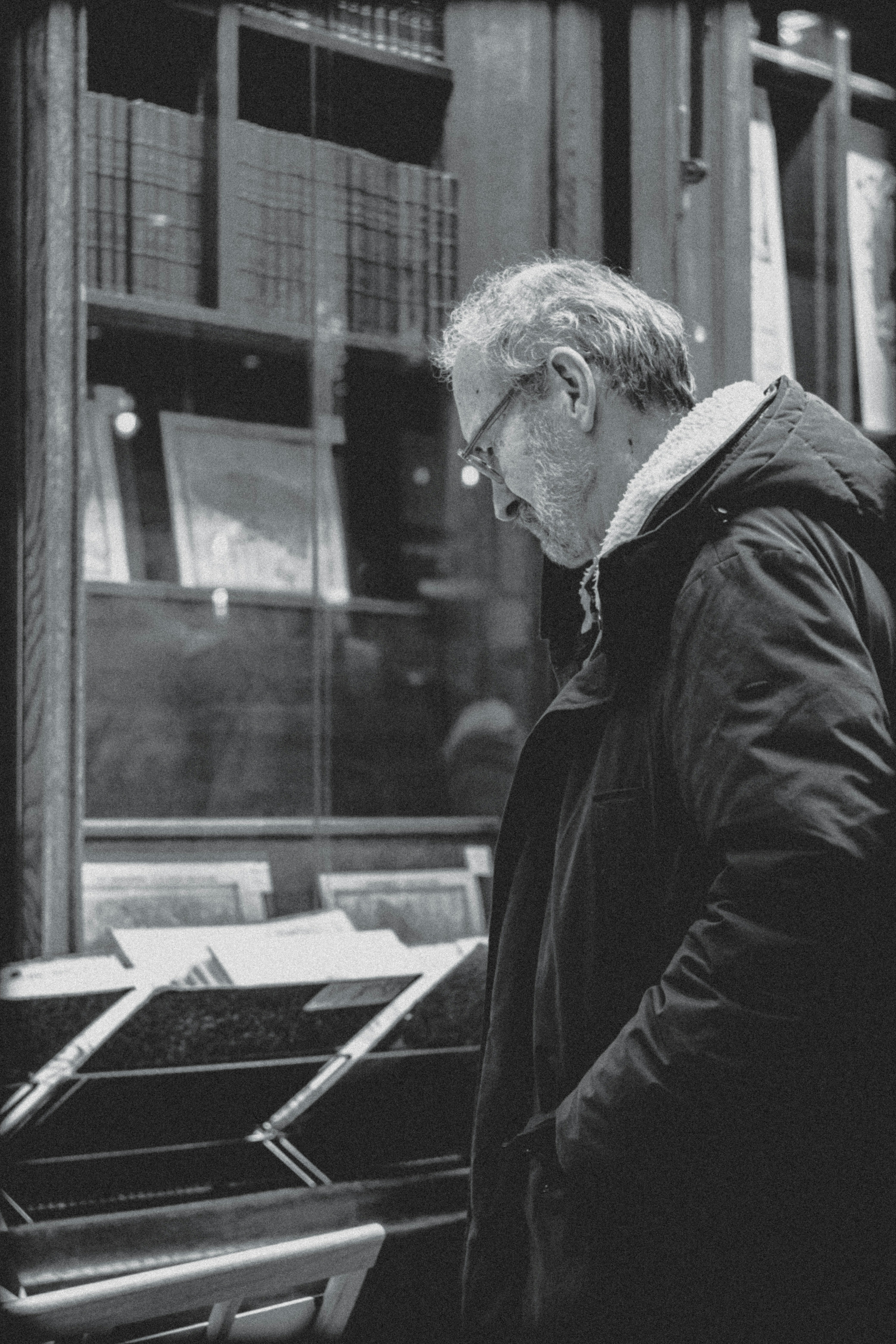 Profile of Quiet Contemplation in a Bookshop Window