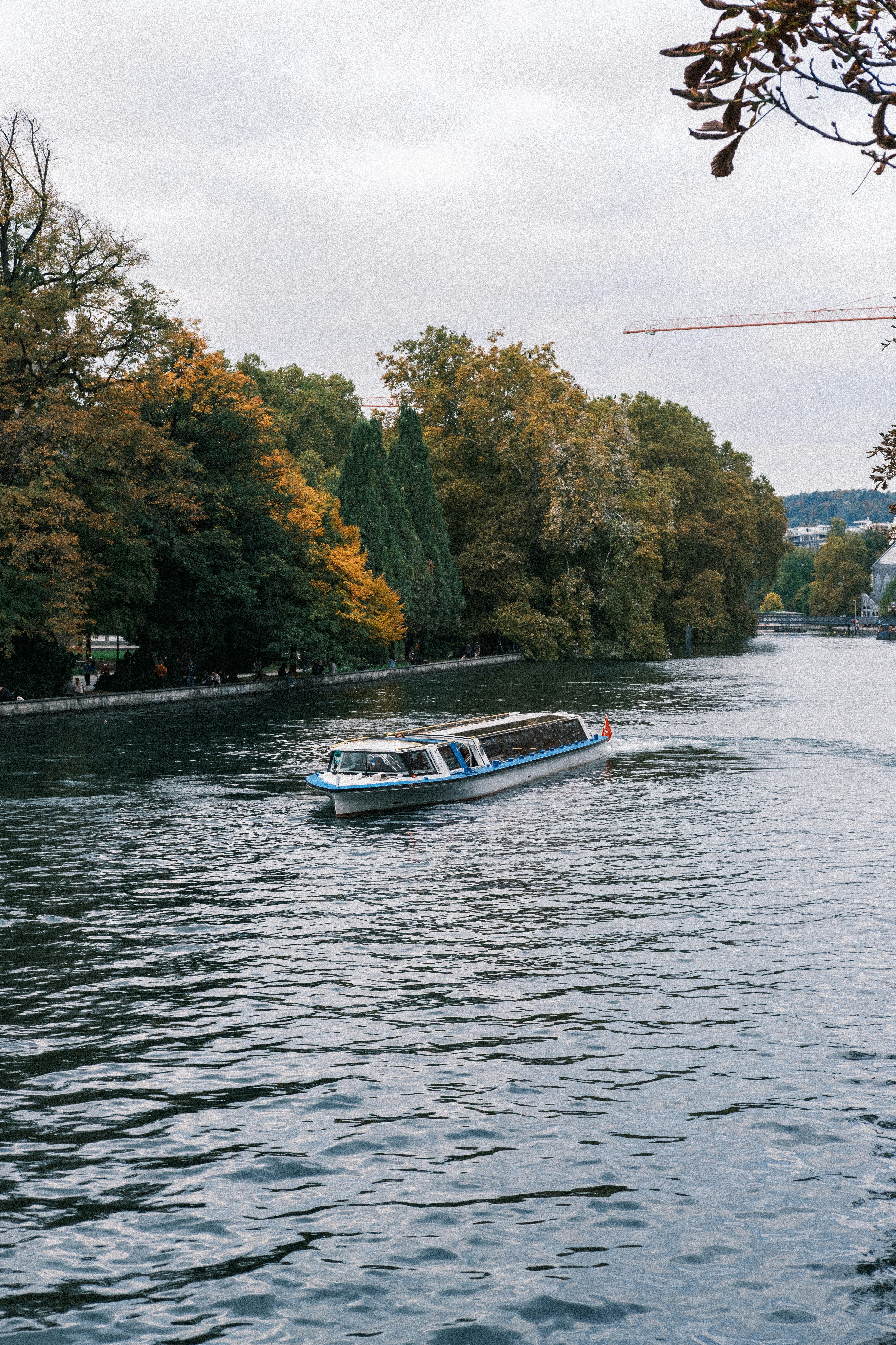 Autumn River Passage: A Boat Carries Through Calm Waters