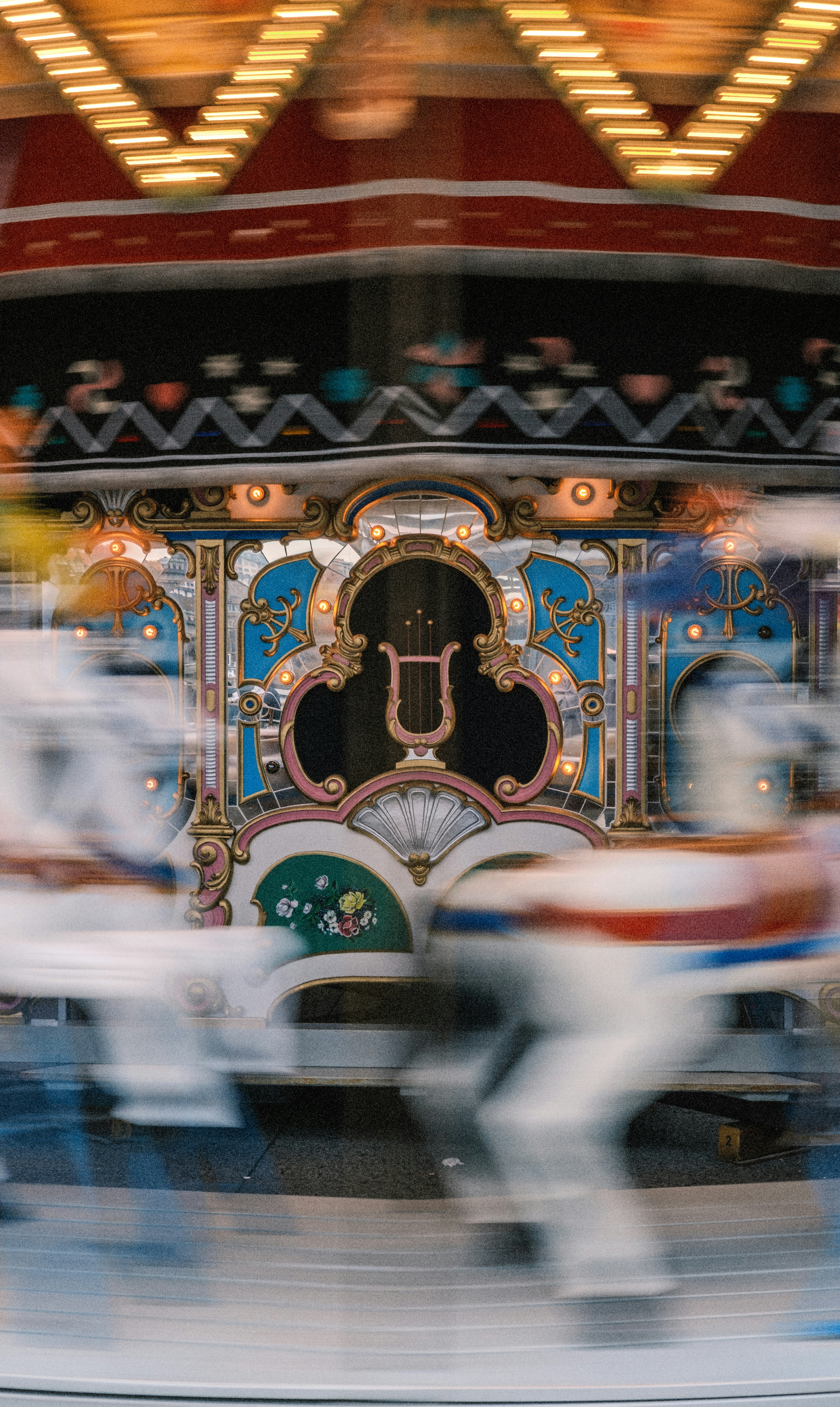 Carousel Portrait: A Blurred Ride Past a Painted Portal