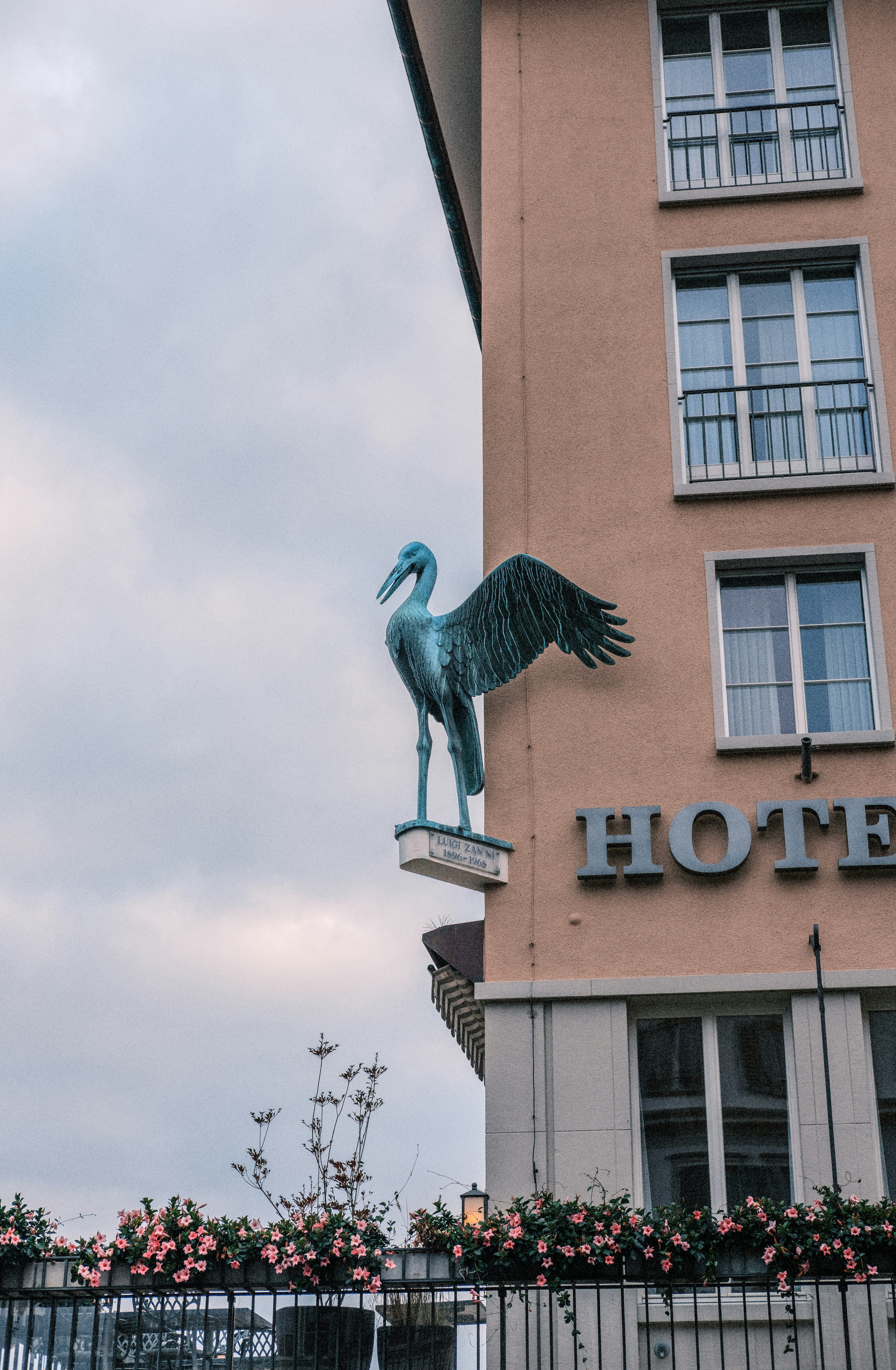Winged Hotel Guardian Overlooking the City