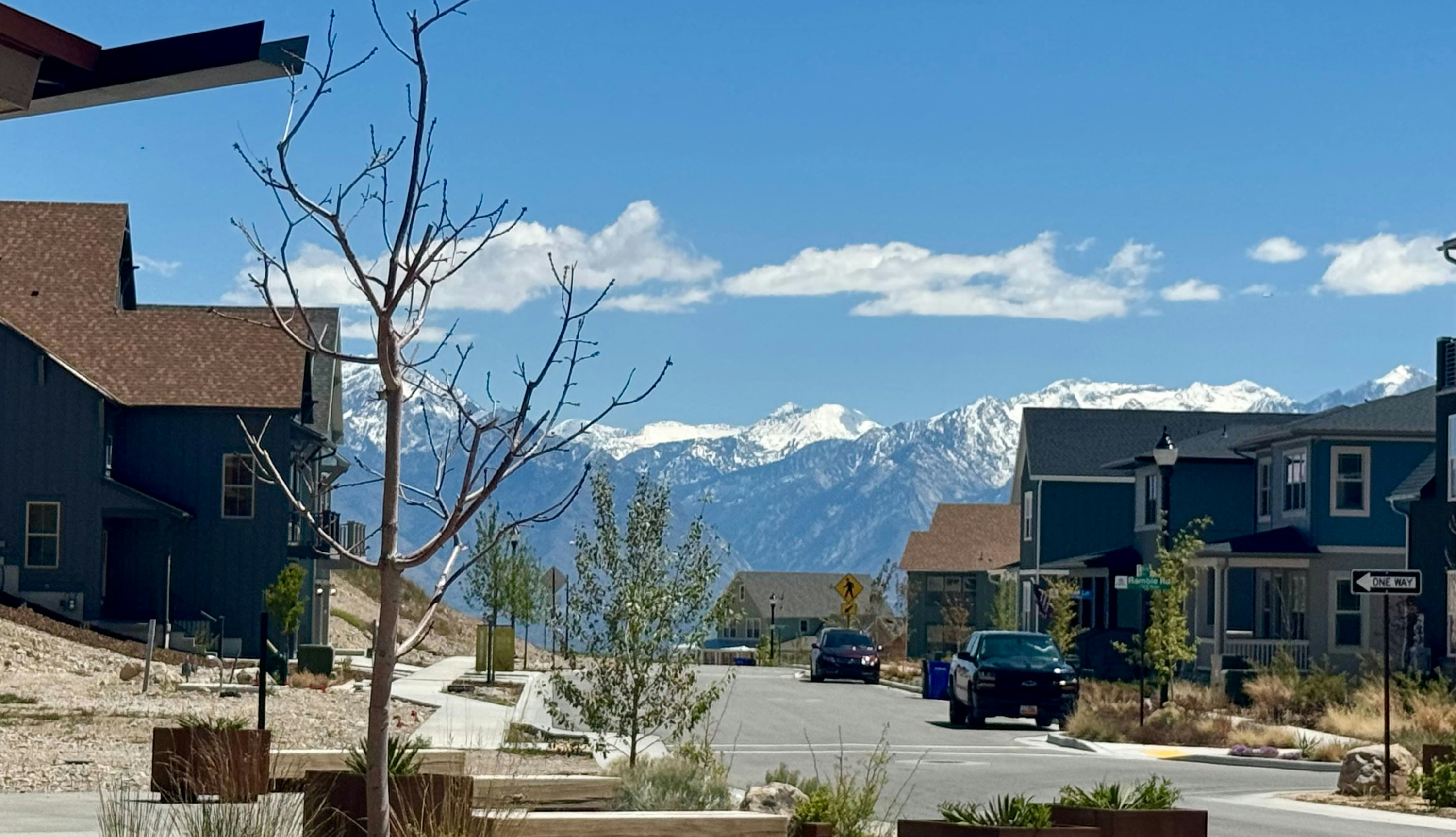 Mountain Vista Framed by a Quiet Suburban Street