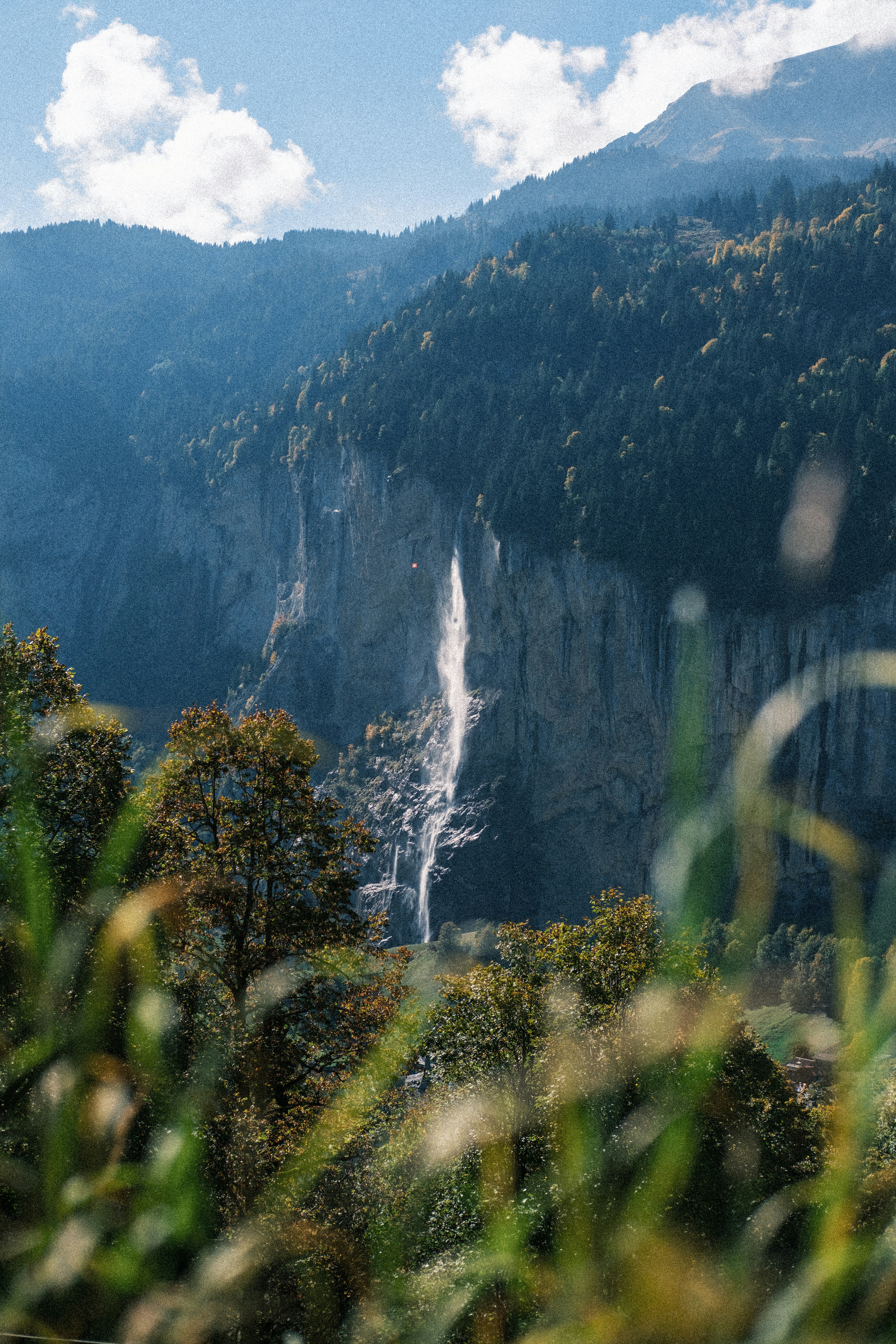 Waterfall cascading down a rocky cliff face.