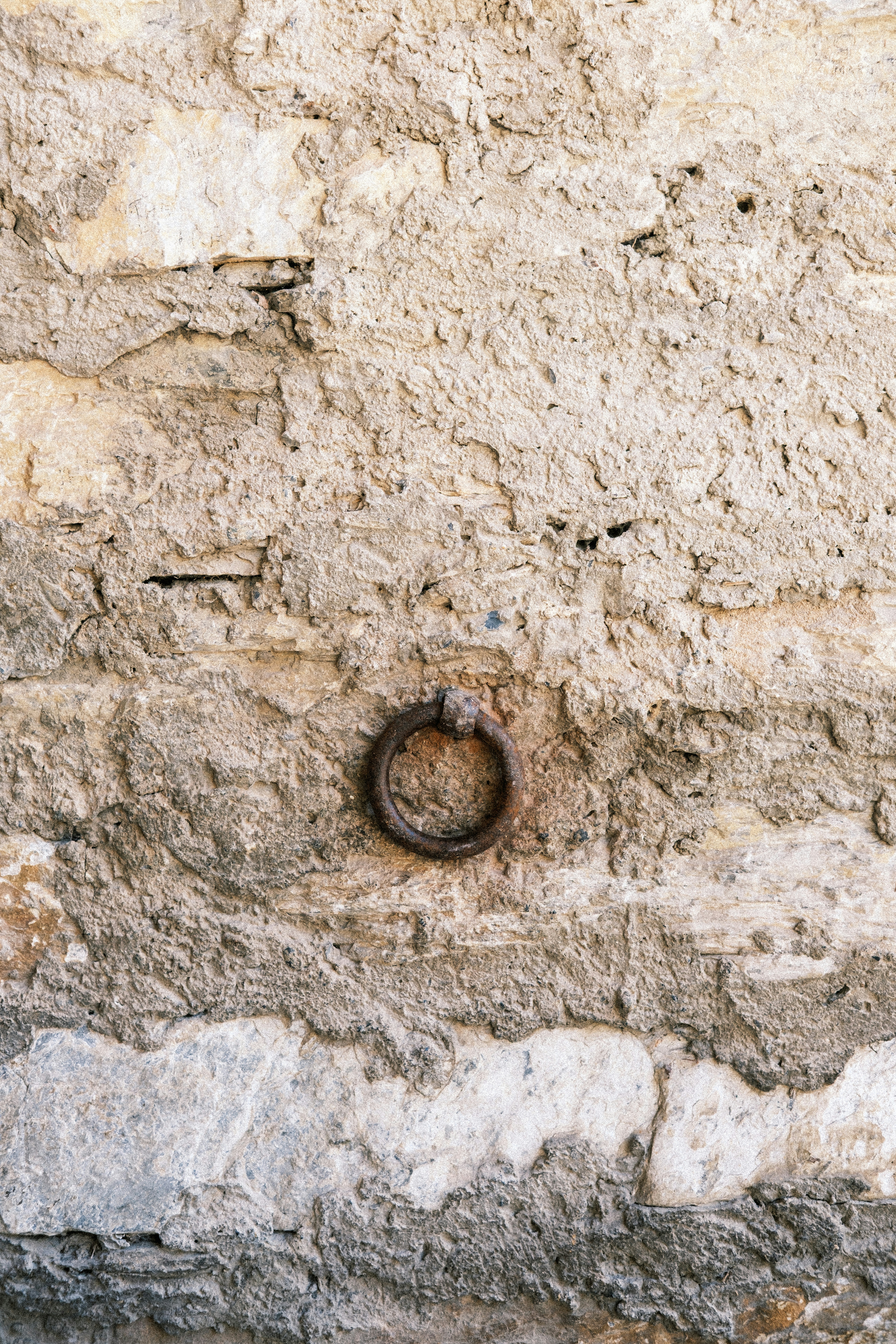 Rust Ring on Weathered Brick: A Quiet Study in Texture and Time