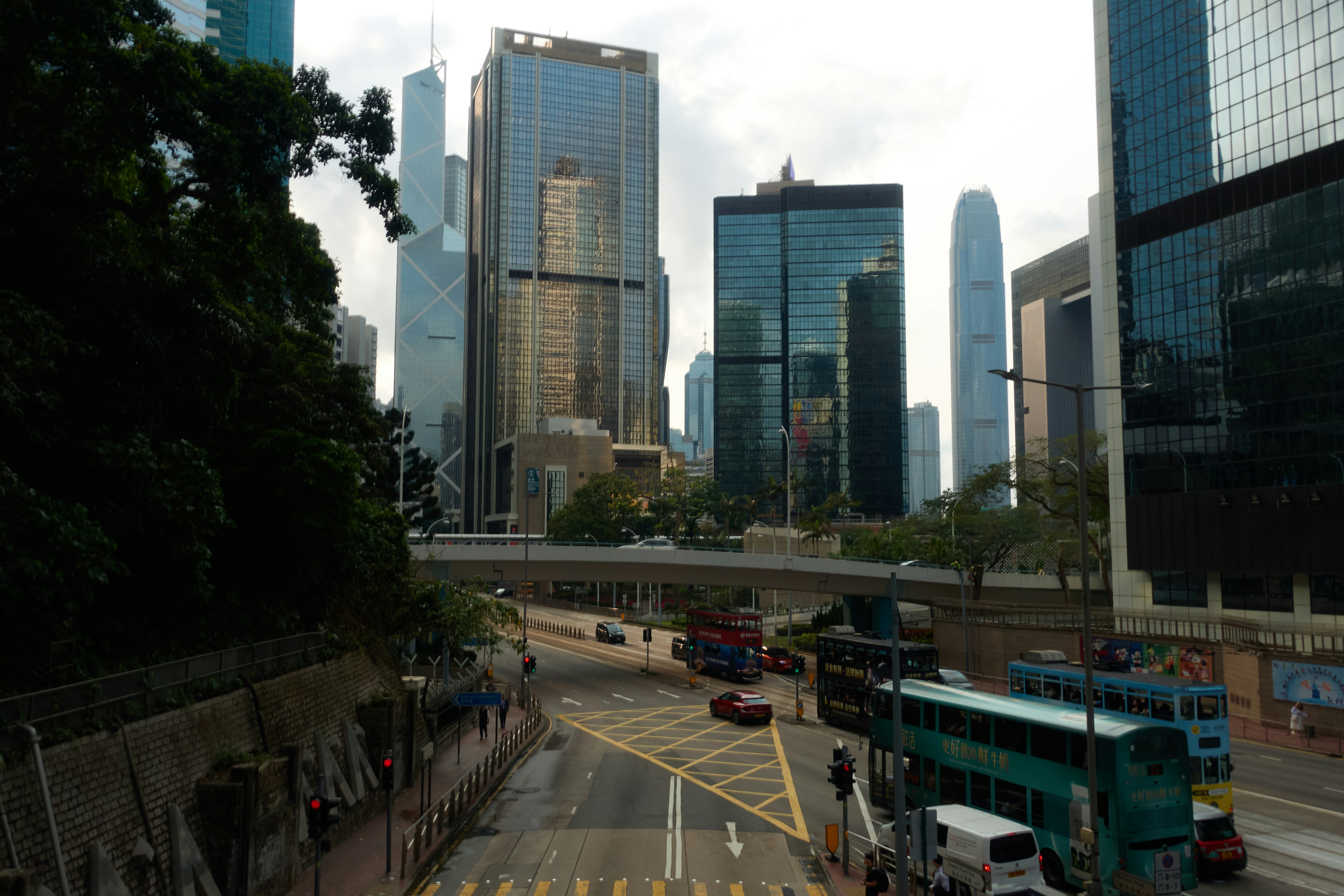 Urban Convergence: Cityscape Overpass Beneath Towering Glass