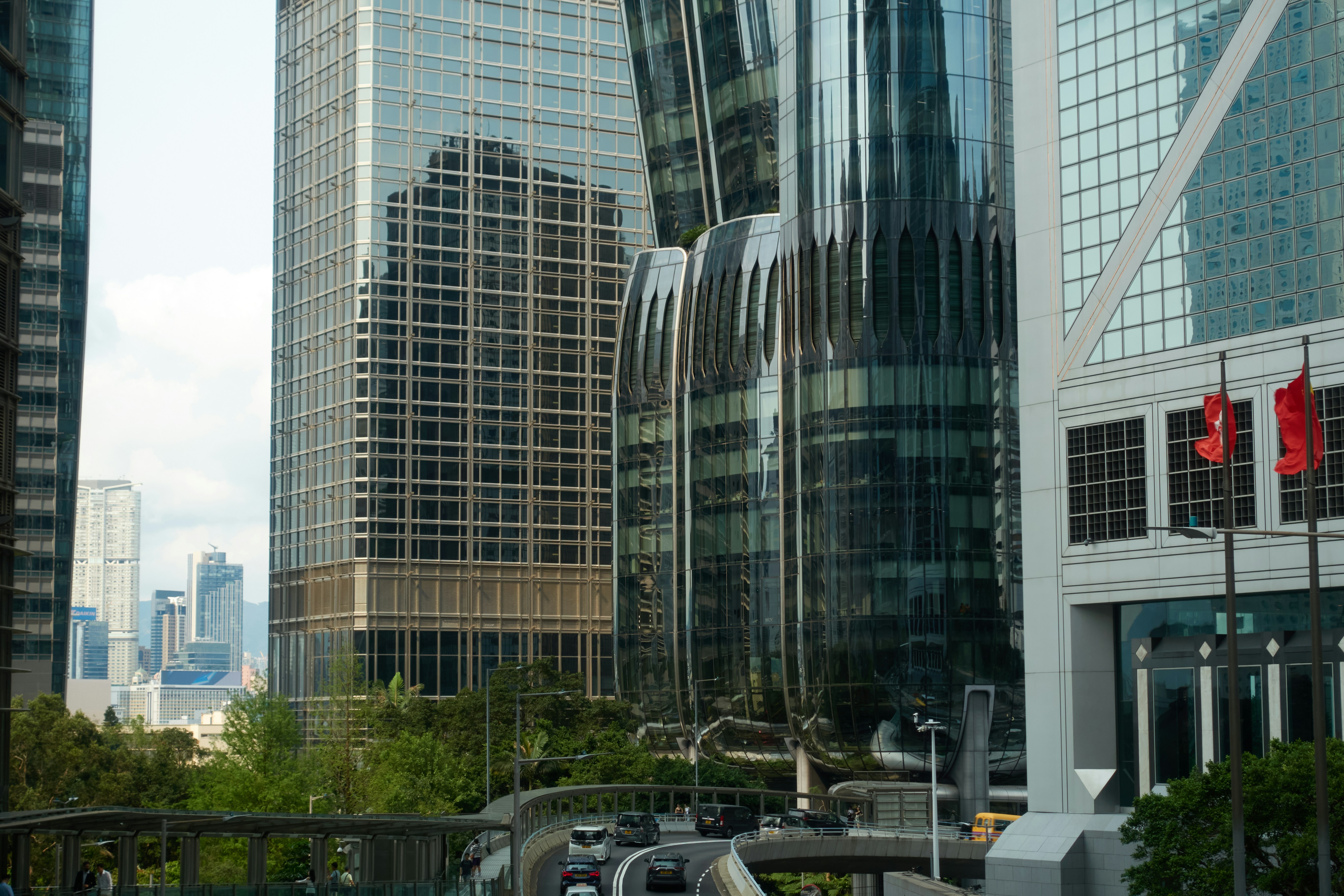Glass And Steel Canopy: Urban Skywalk Framed by Skyscrapers