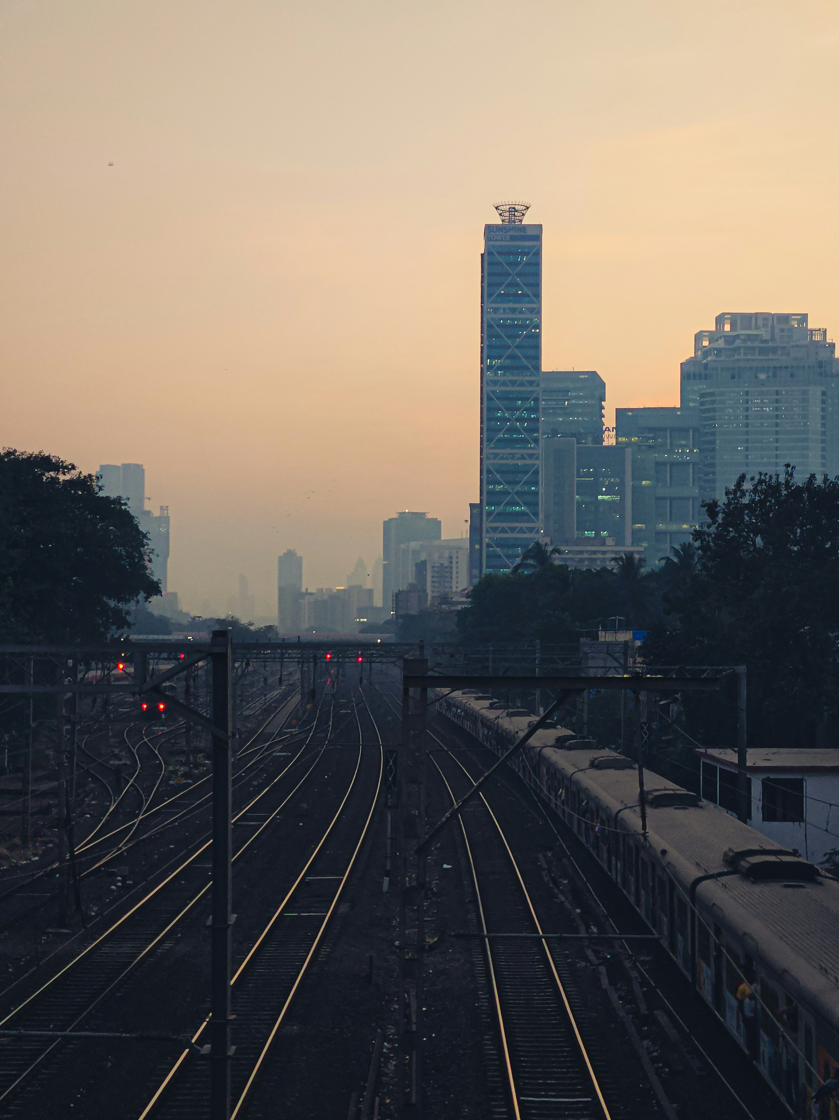 Sunset Commuter Lines: A City’s Quiet Horizon Over Rails