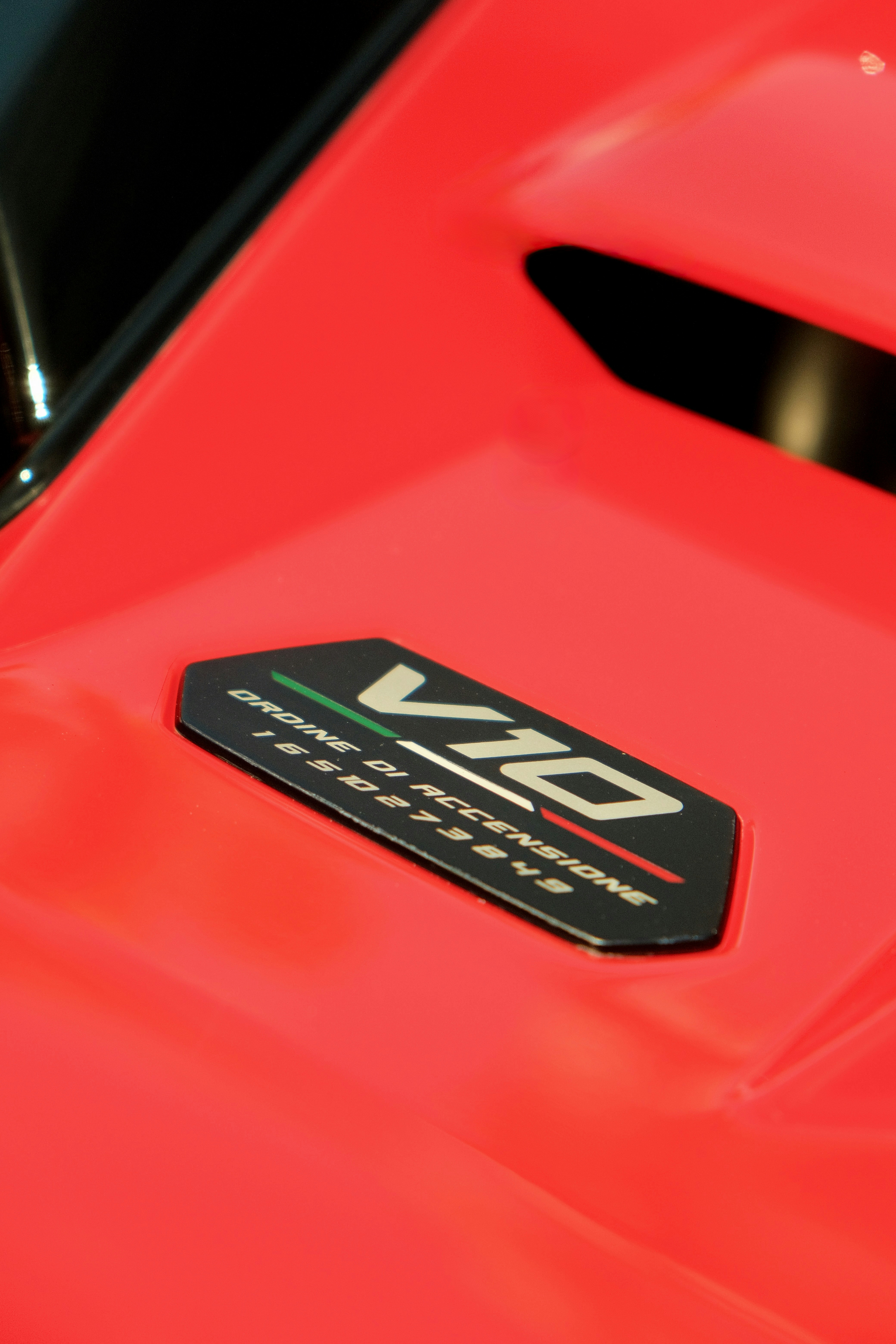 Red V8 Emblem: A Bold Close-Up on Motor Passion