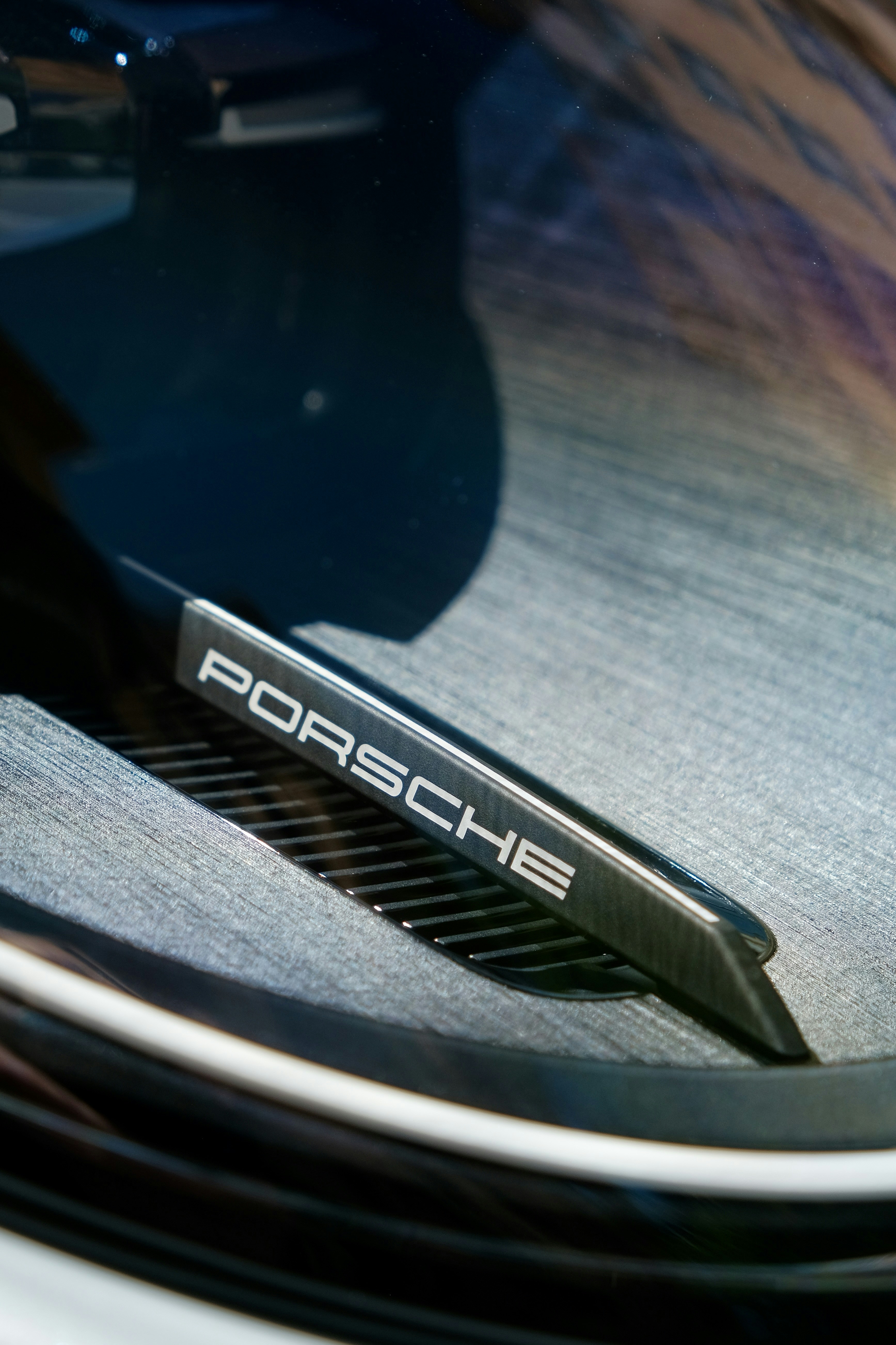 Porsche Insignia gleam on the car's door sill