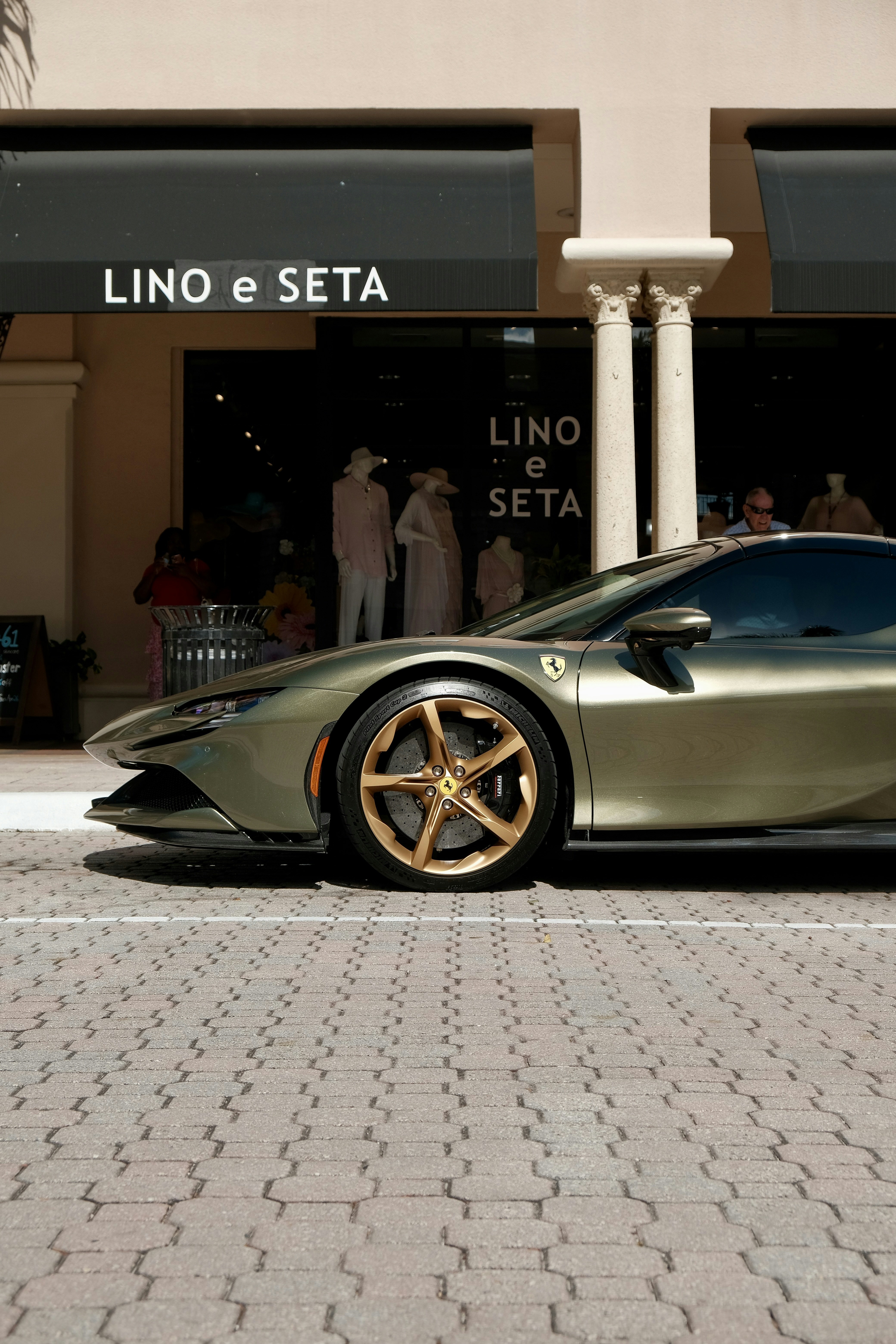 Green Ferrari, Golden Rims: Streetfront Drama