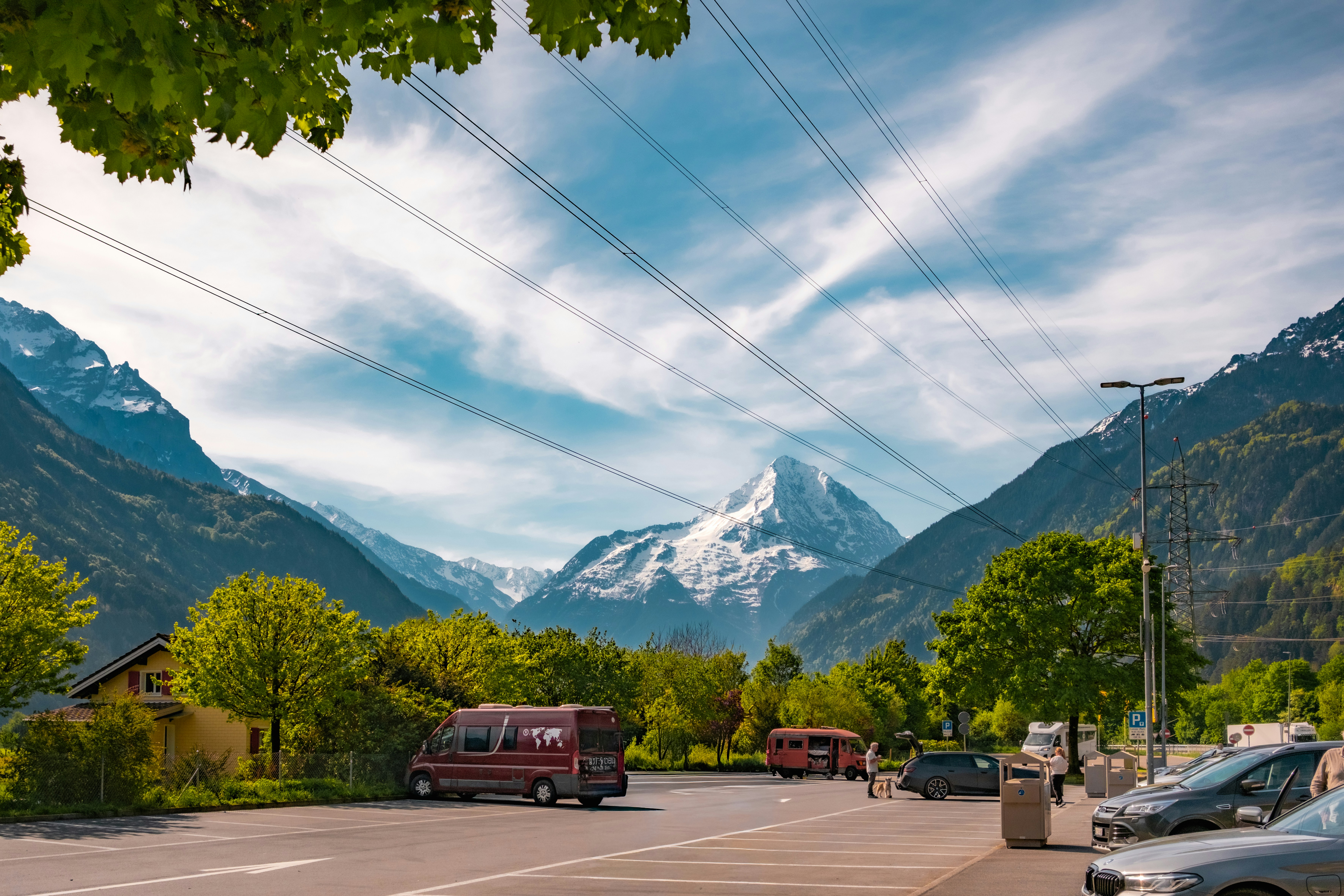 Snow-capped Peak Rising Behind a Valley Town