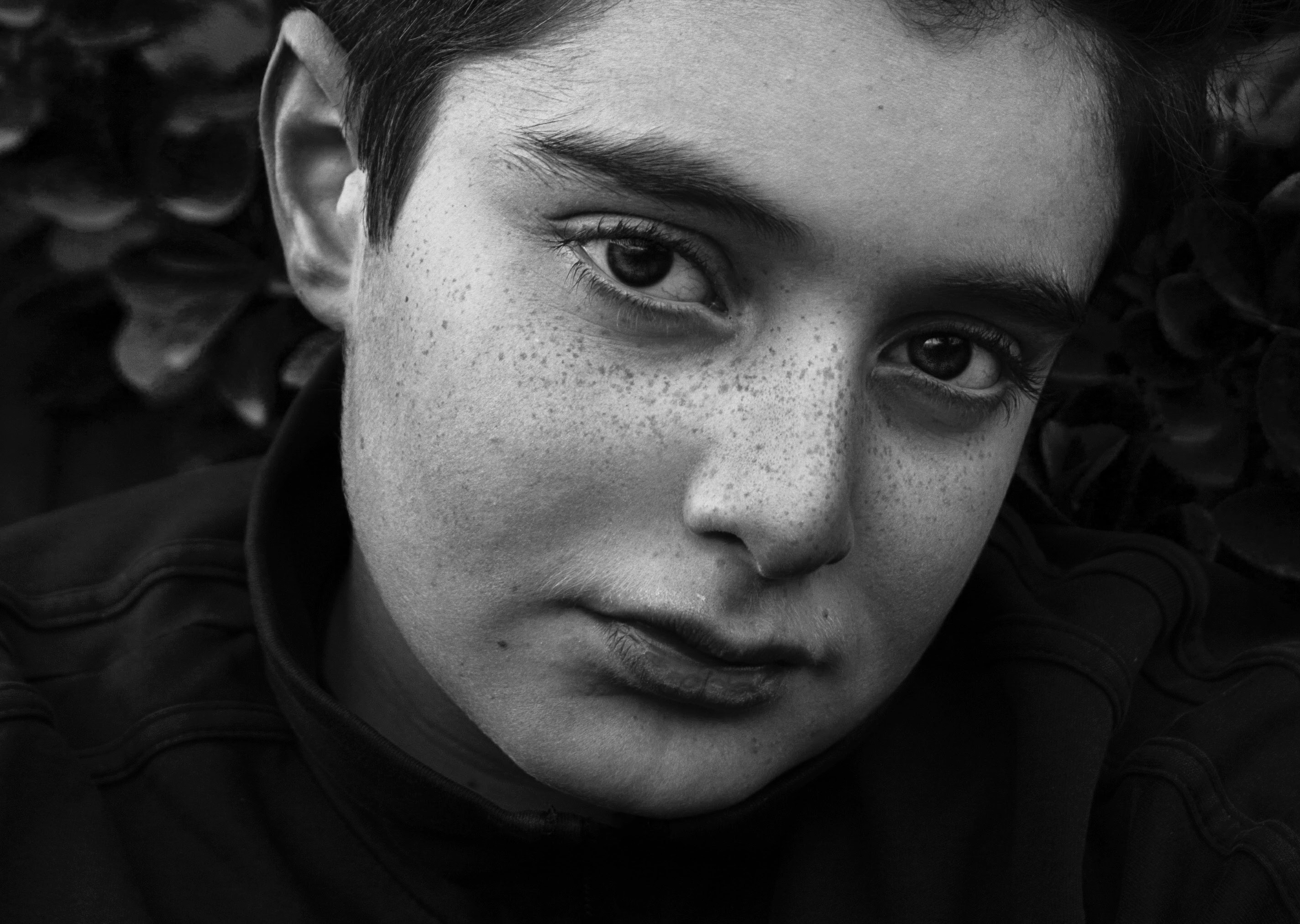 Quiet Gaze: A Portrait with Soft Shadows and Freckled Light