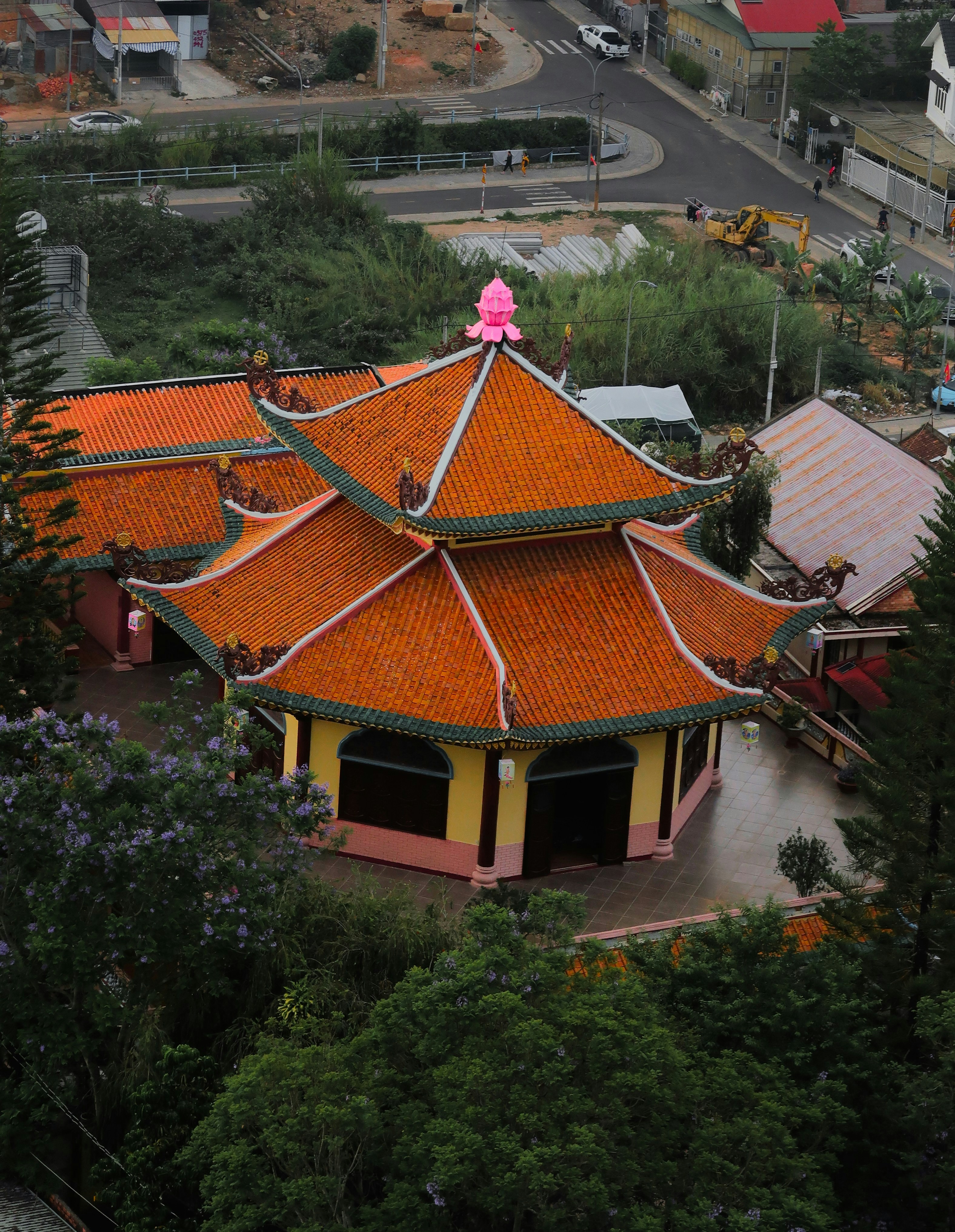Orange-Tiled Temple at the Edge of the Hill