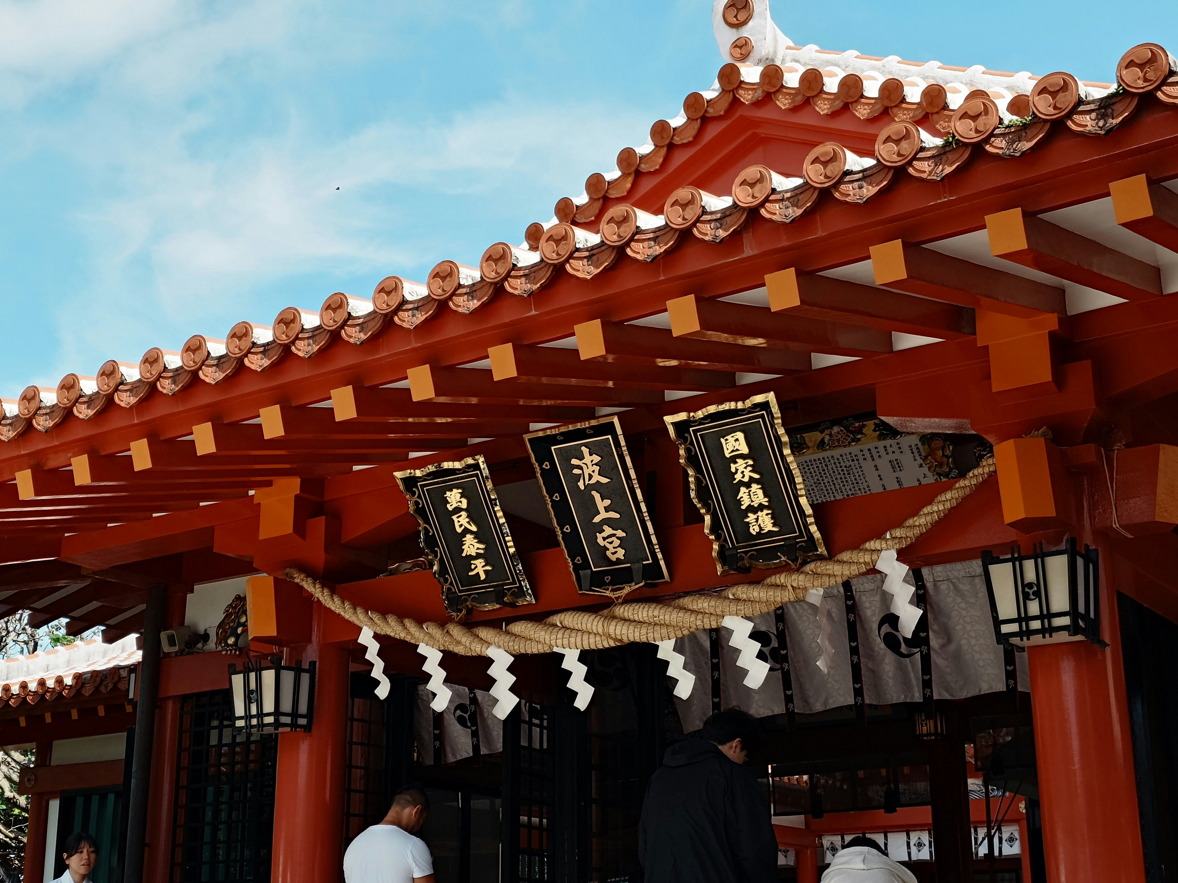 Temple Entry Canopy: Red Columns and Black Lanterns