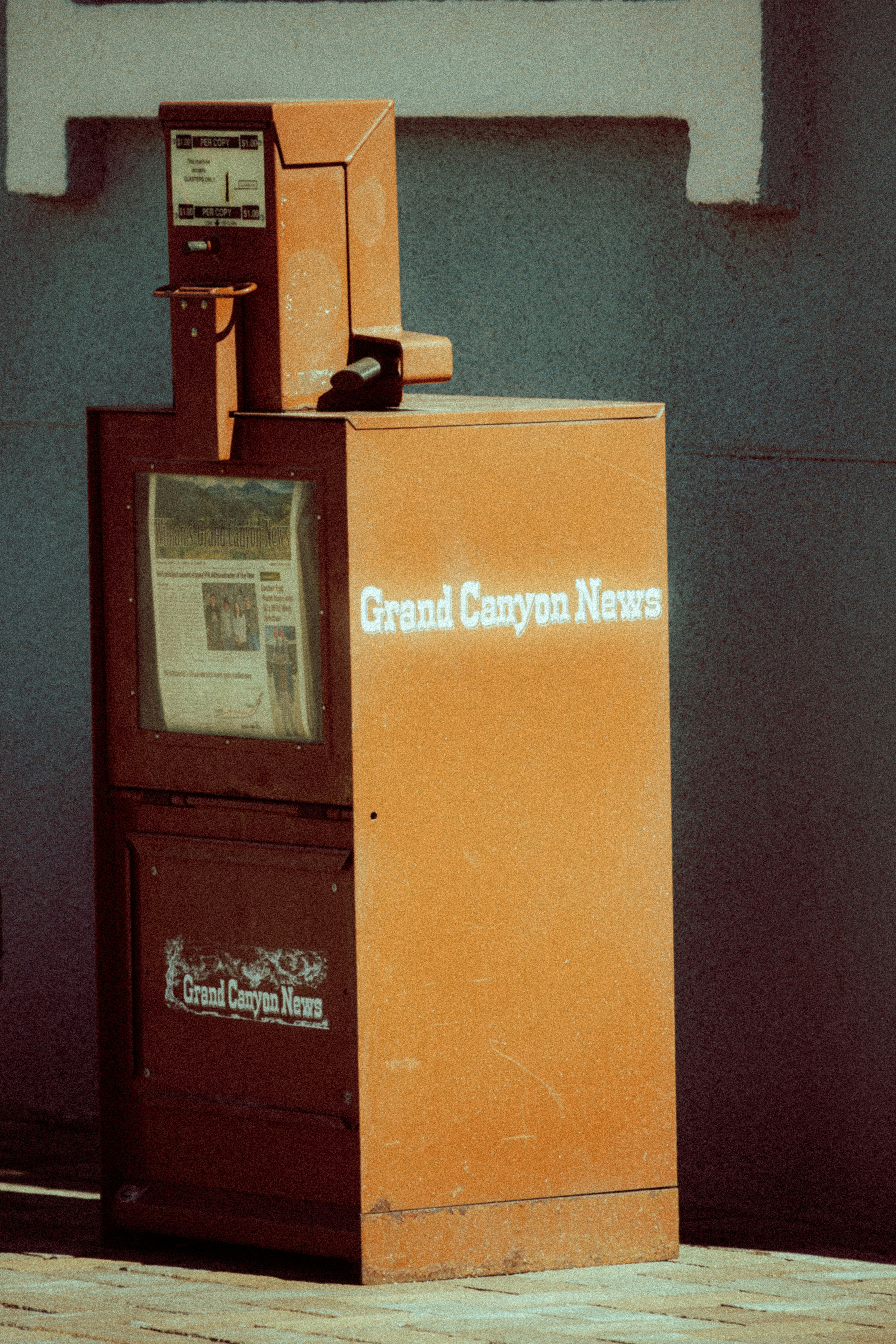 Orange Grand Canyon News Stand in Soft Sunset Glow