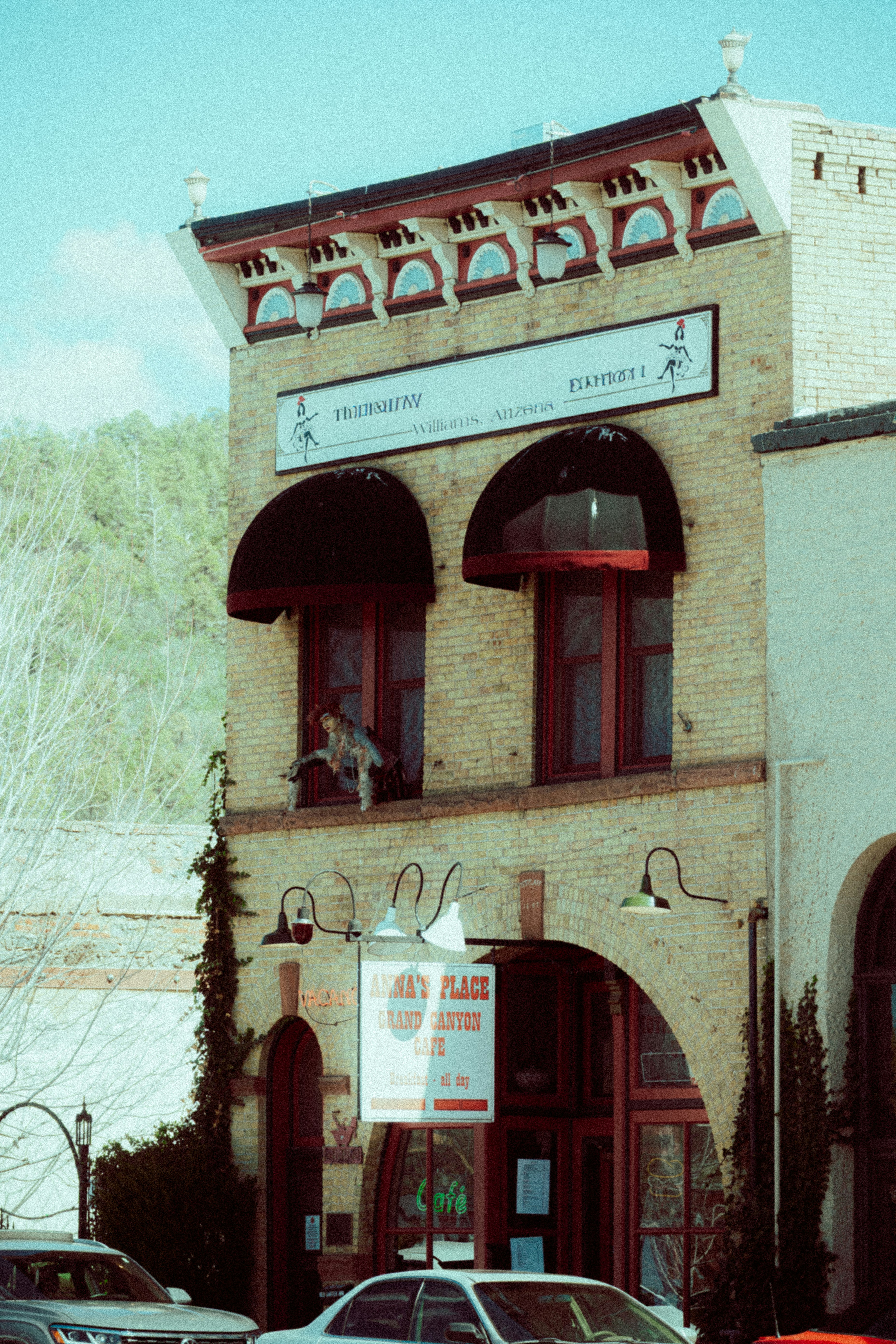 Old Town Arcades: A Brick Facade with Red Awnings and Lanterns