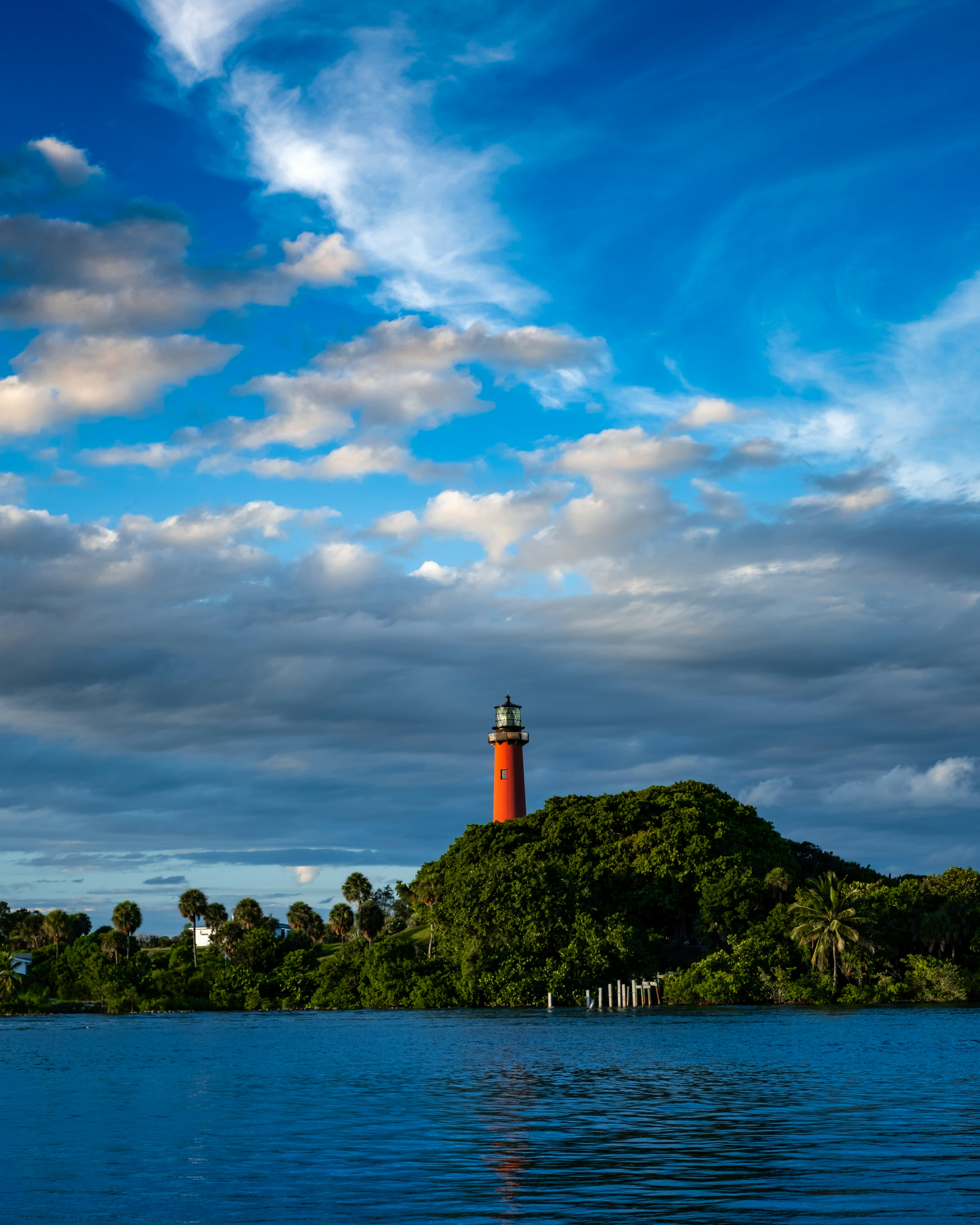 Lighthouse Sentinel Over Coral Island at Dusk