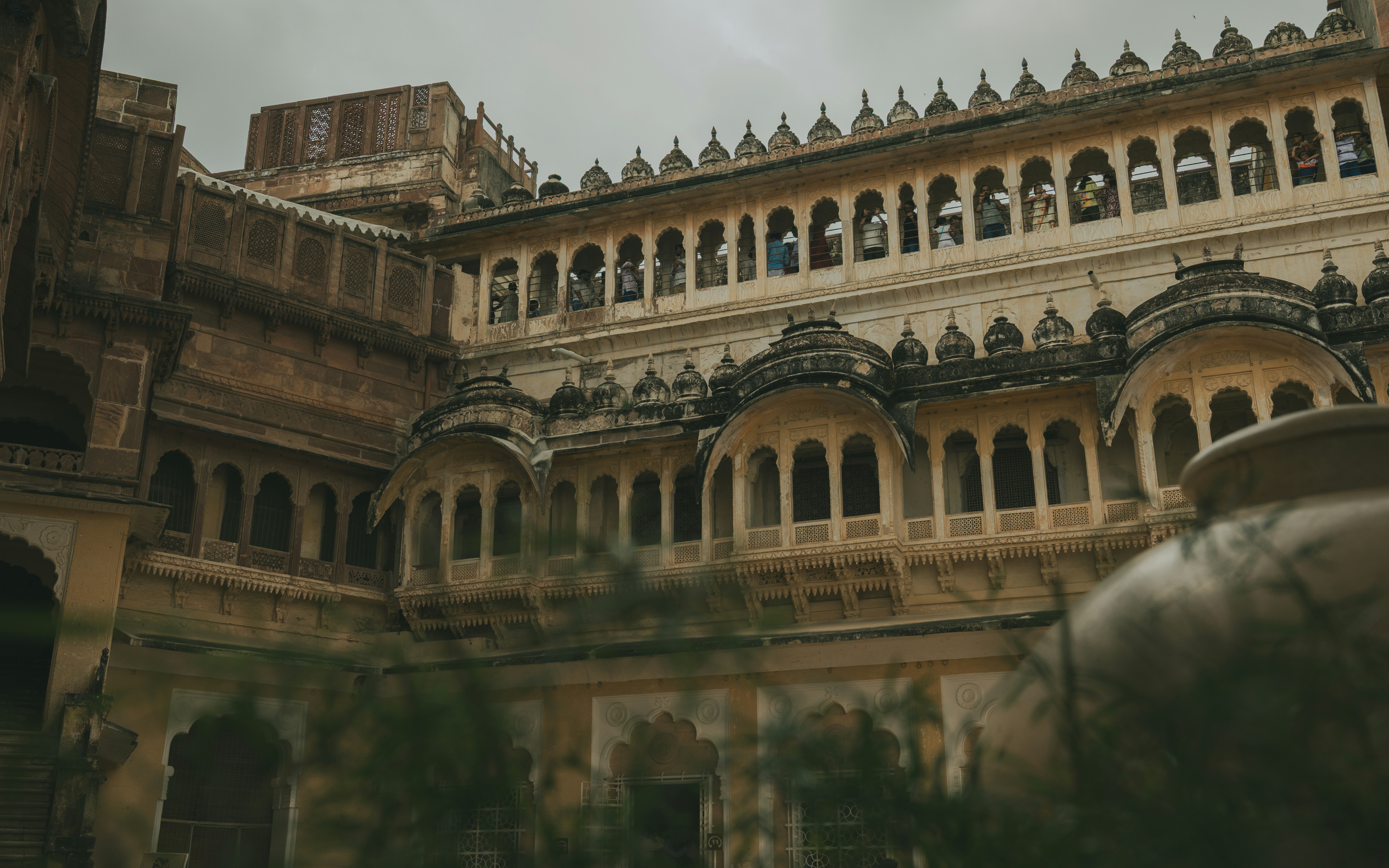 Ornate Courtyard Facade: arches and balconies at dusk