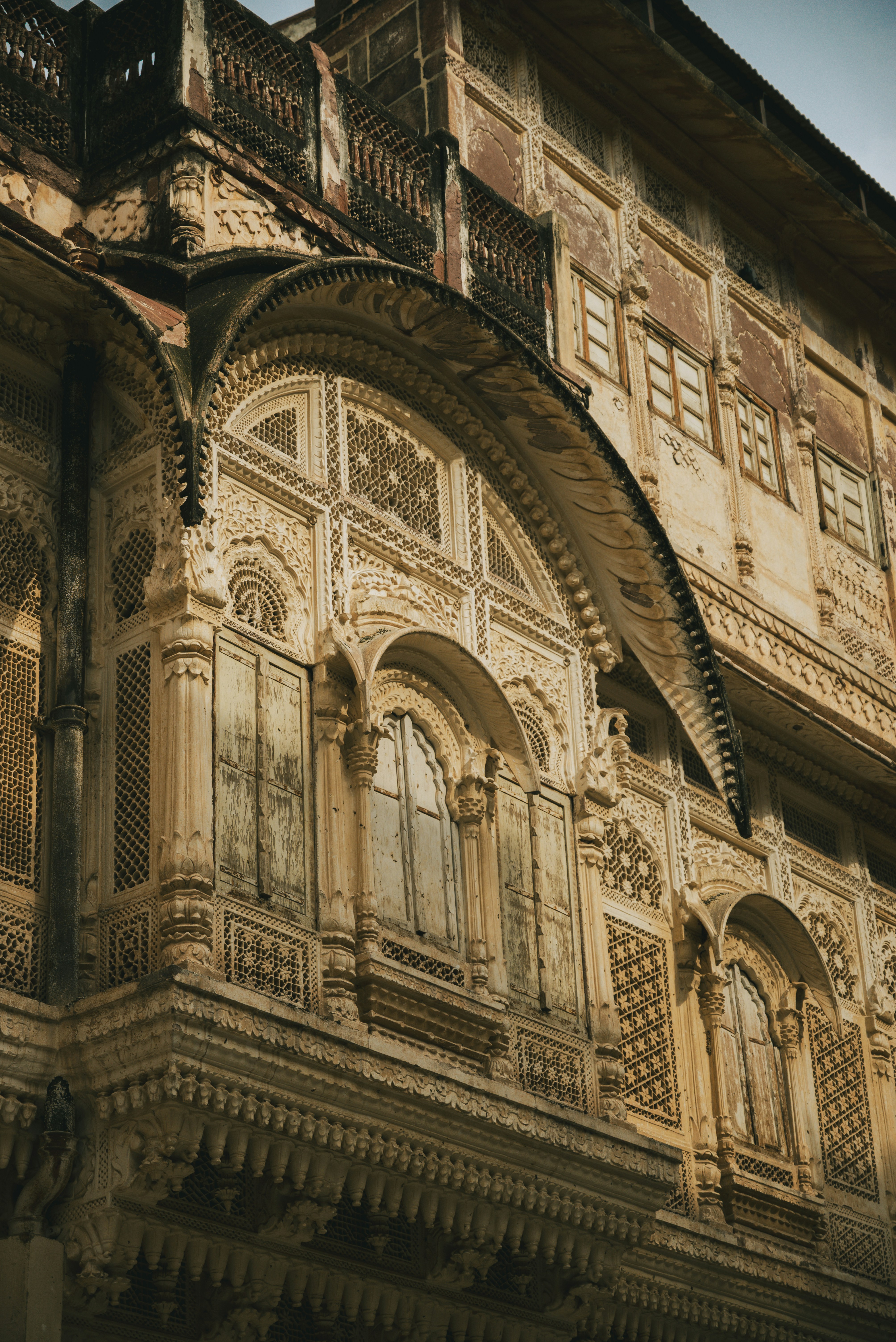 Intricate carvings on an old stone building facade