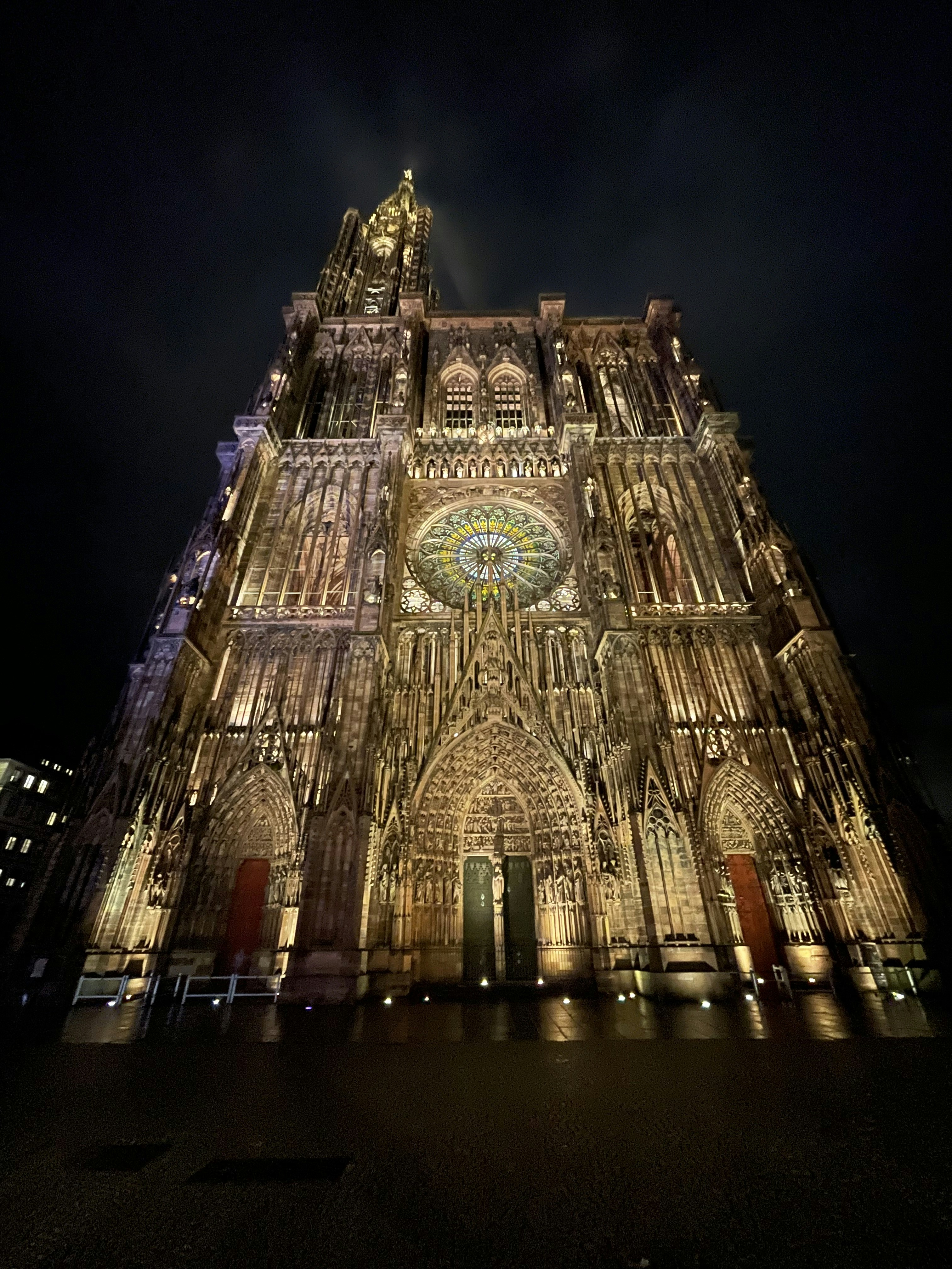 Stained Glass Cathedral at Night: Gothic Majesty Looms in Lights
