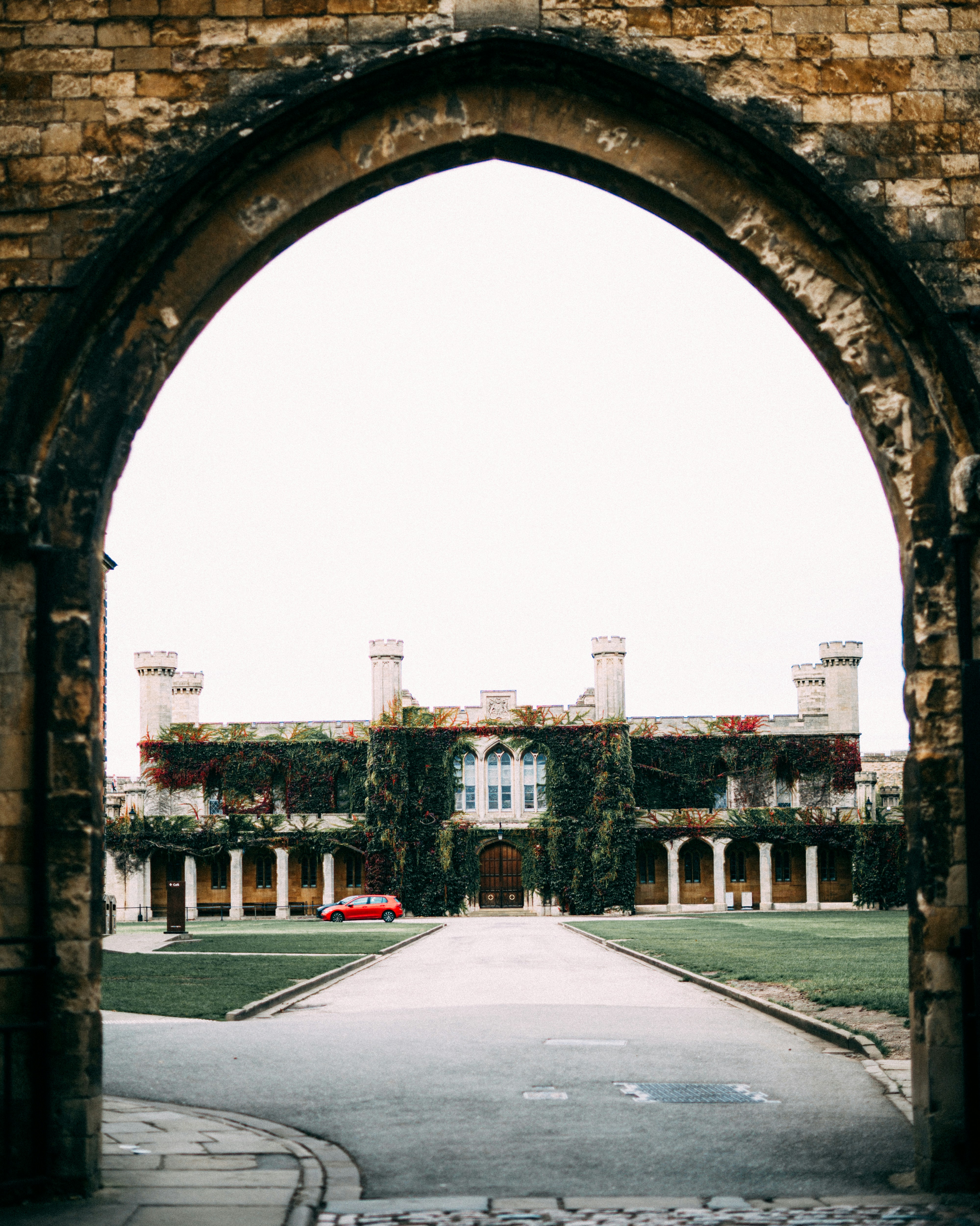 Through the Arch: A Courtyard Gate Framed by Ivy and Archway