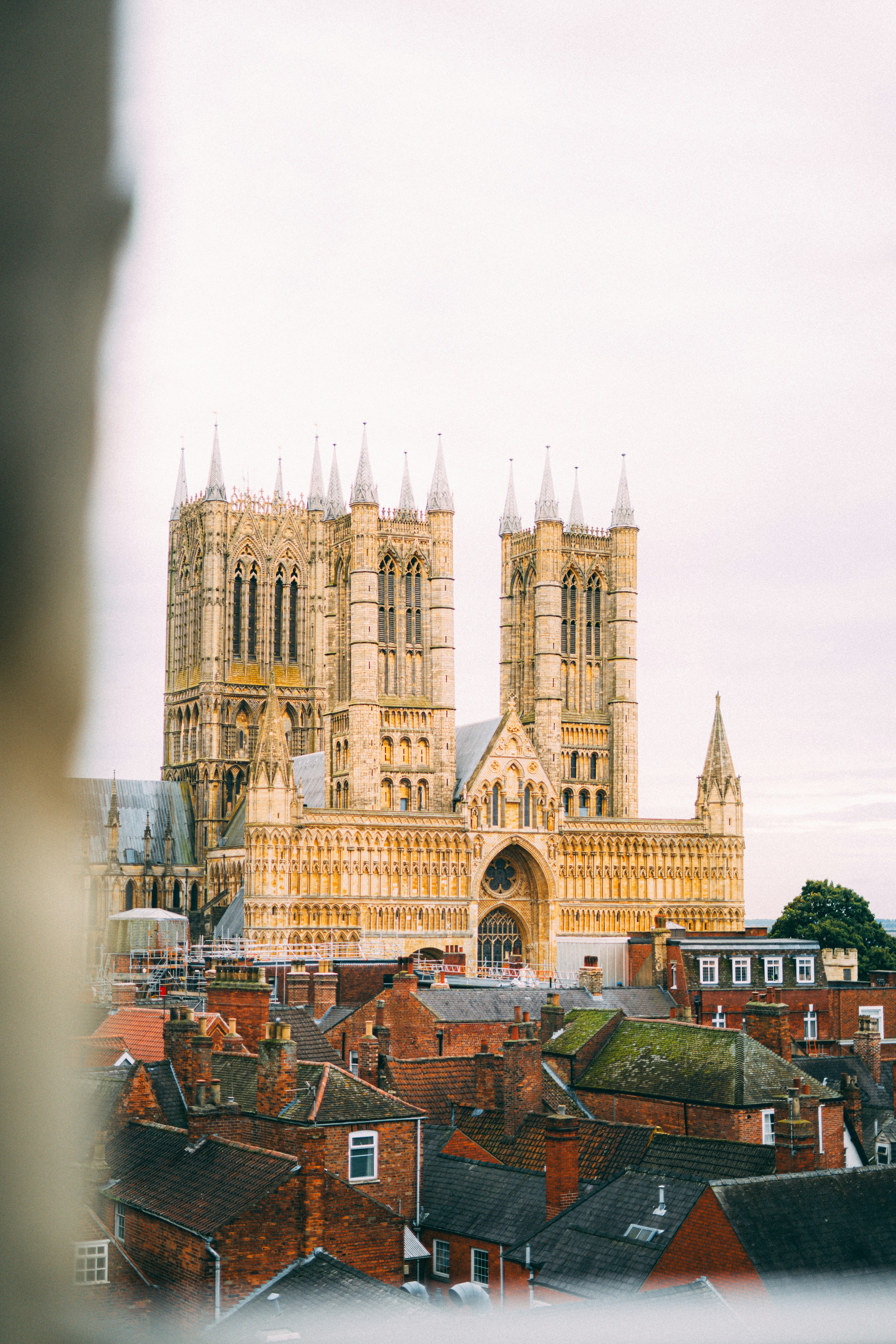 Cathedral silhouette rising above a quaint rooftop town