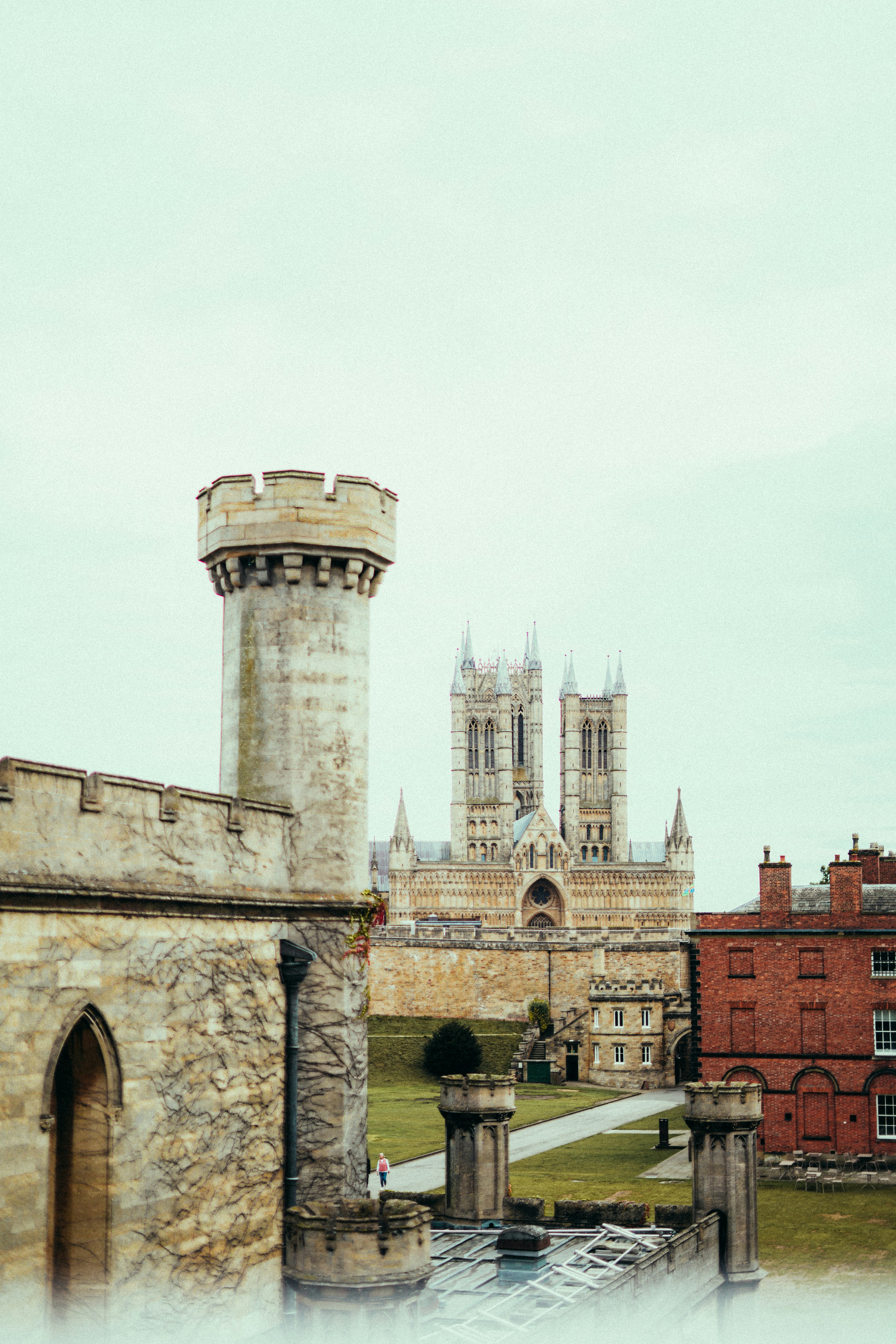 Castle Courtyard Fragments: Tower, Wall, and Cathedral in Soft Light