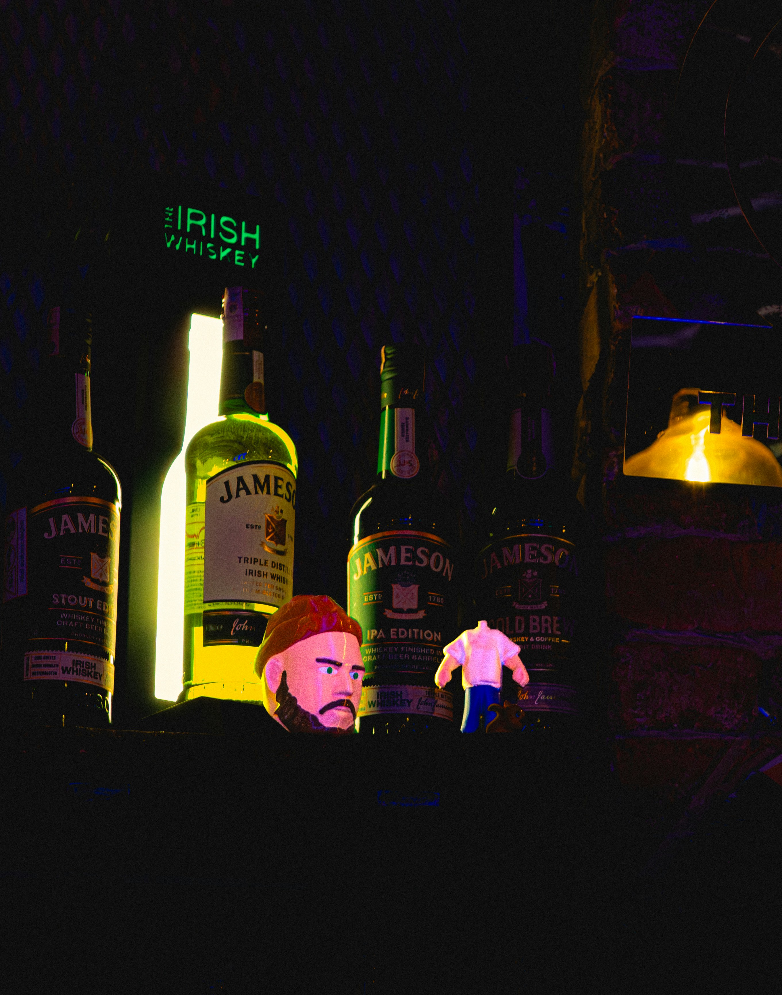 Neon-lit Bar Shelves with Miniature Figures in the Glow