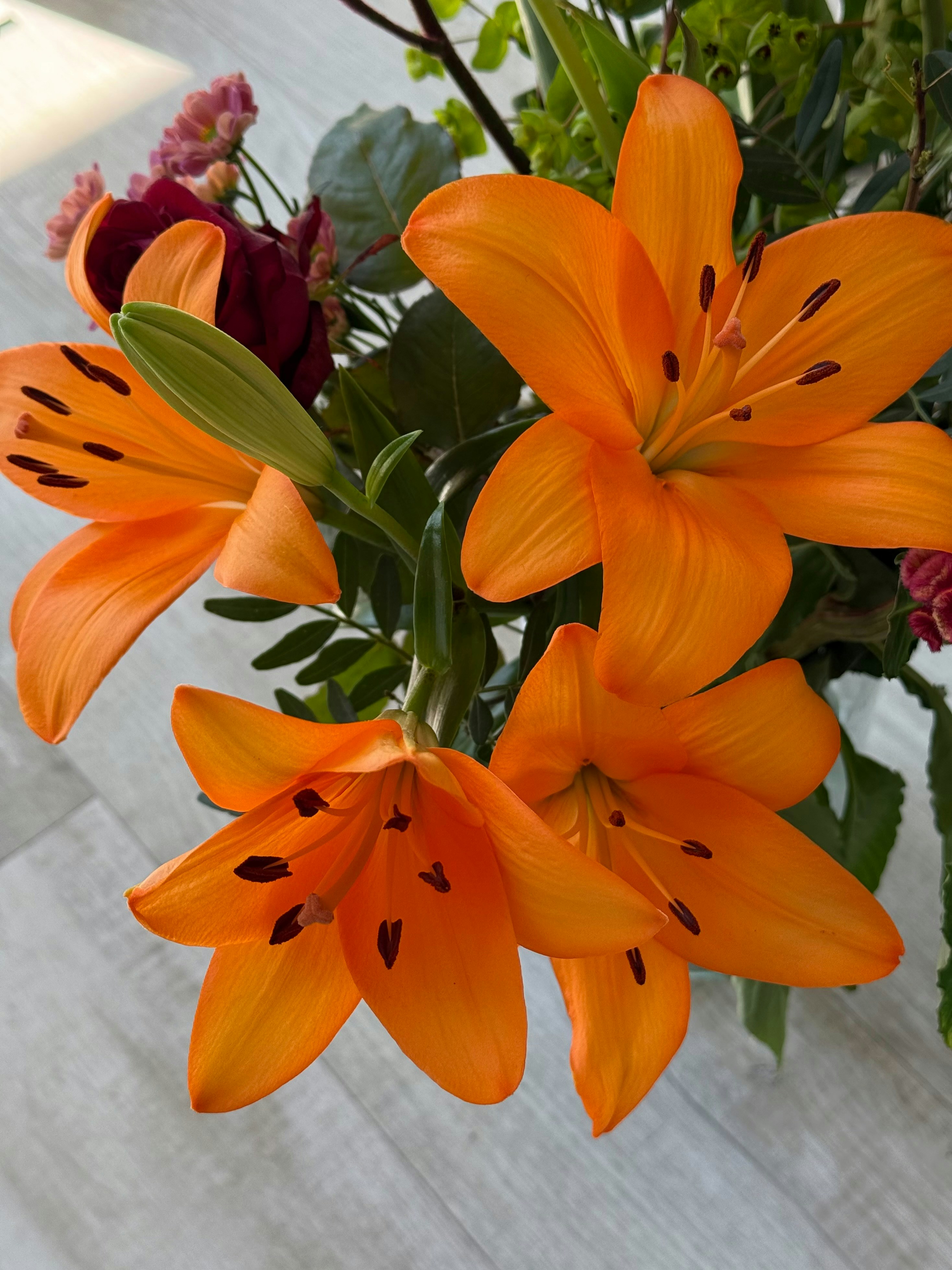 Vivid Orange Lilies in a Bustling Bouquet