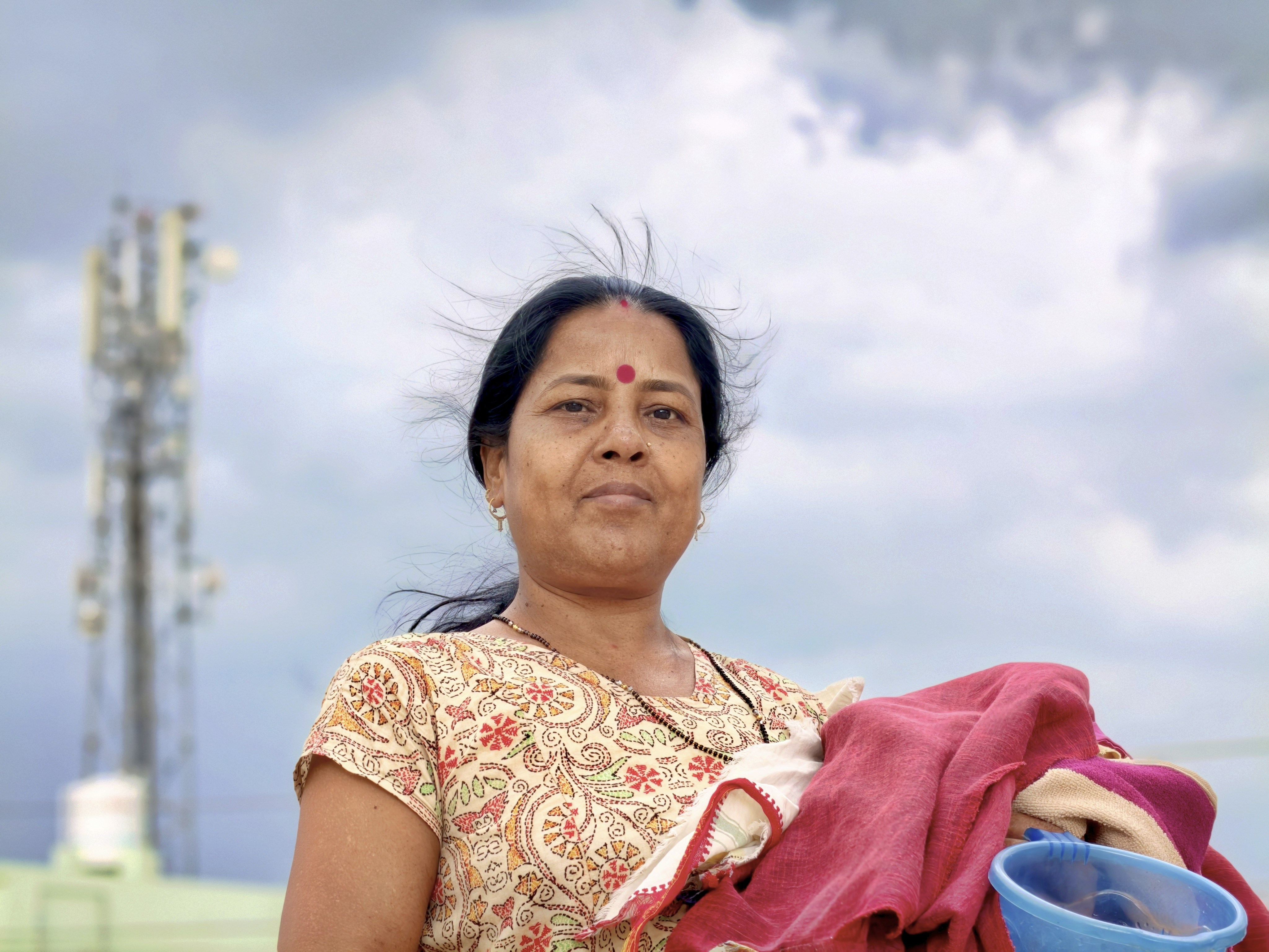 Terracotta Bloom: Portrait under a Vast Sky