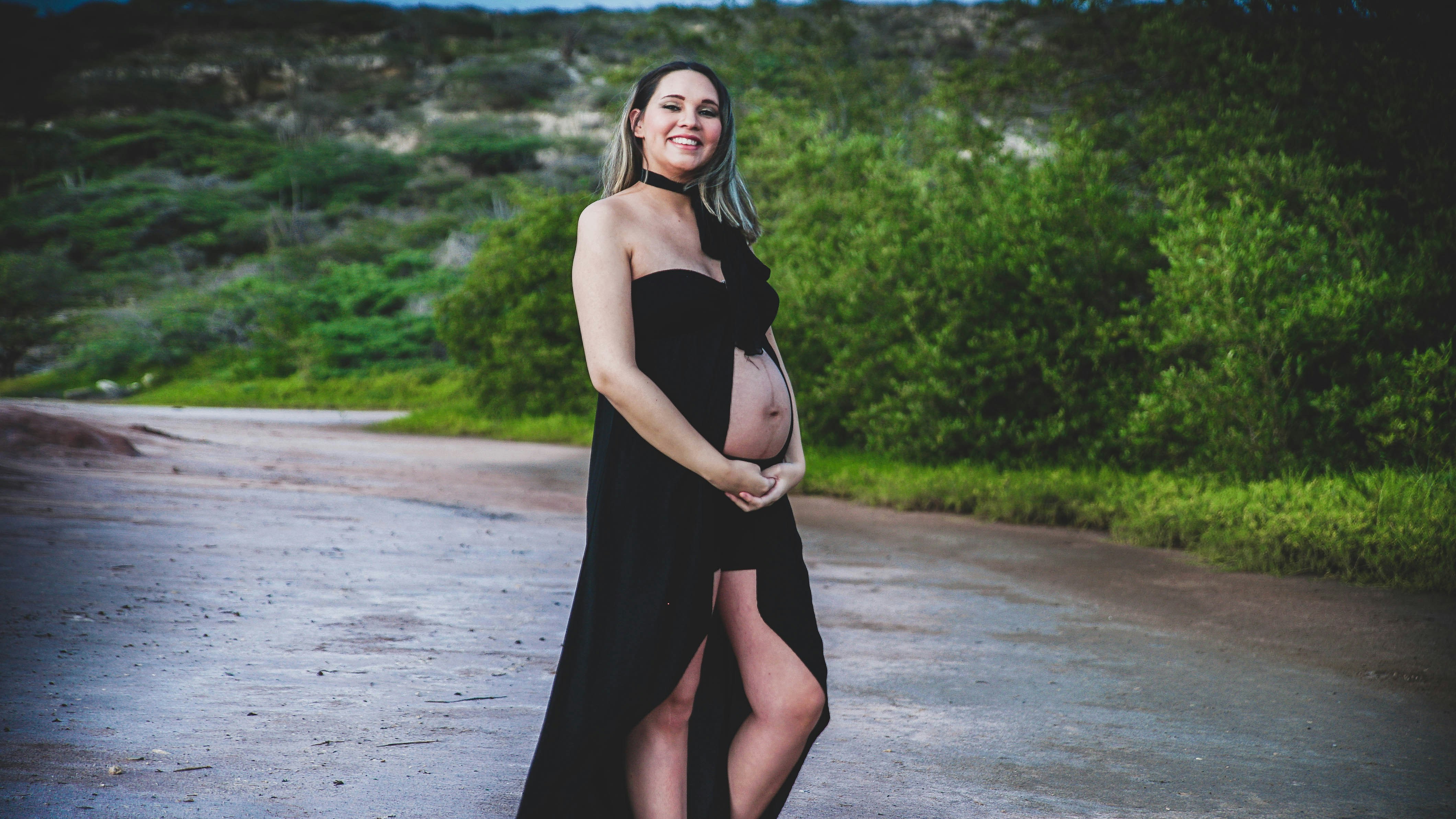 Pregnant Poise on a Quiet Shoreline Road