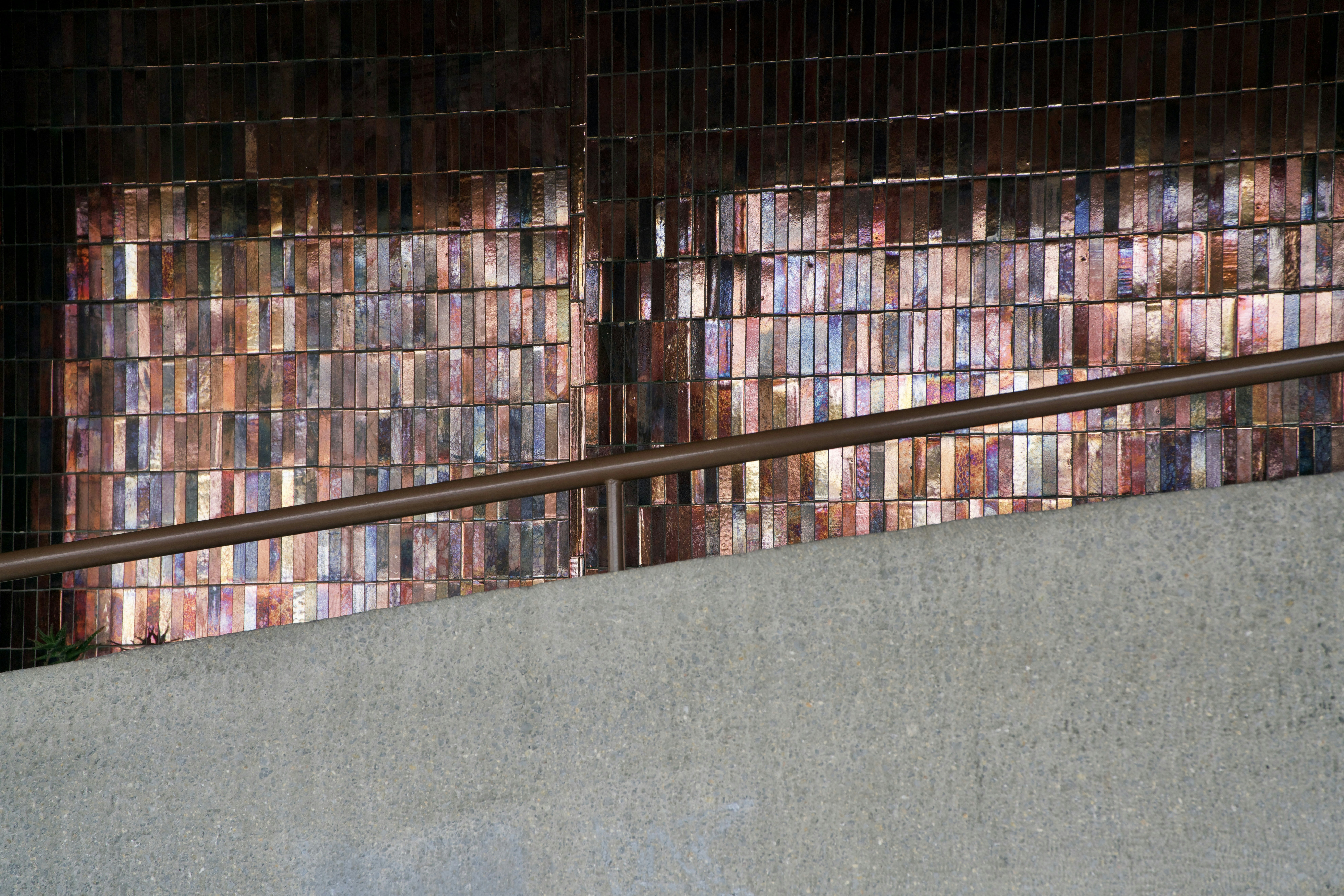 Colorful Mosaic Ramp: A Quiet Composition of Tiles and Concrete