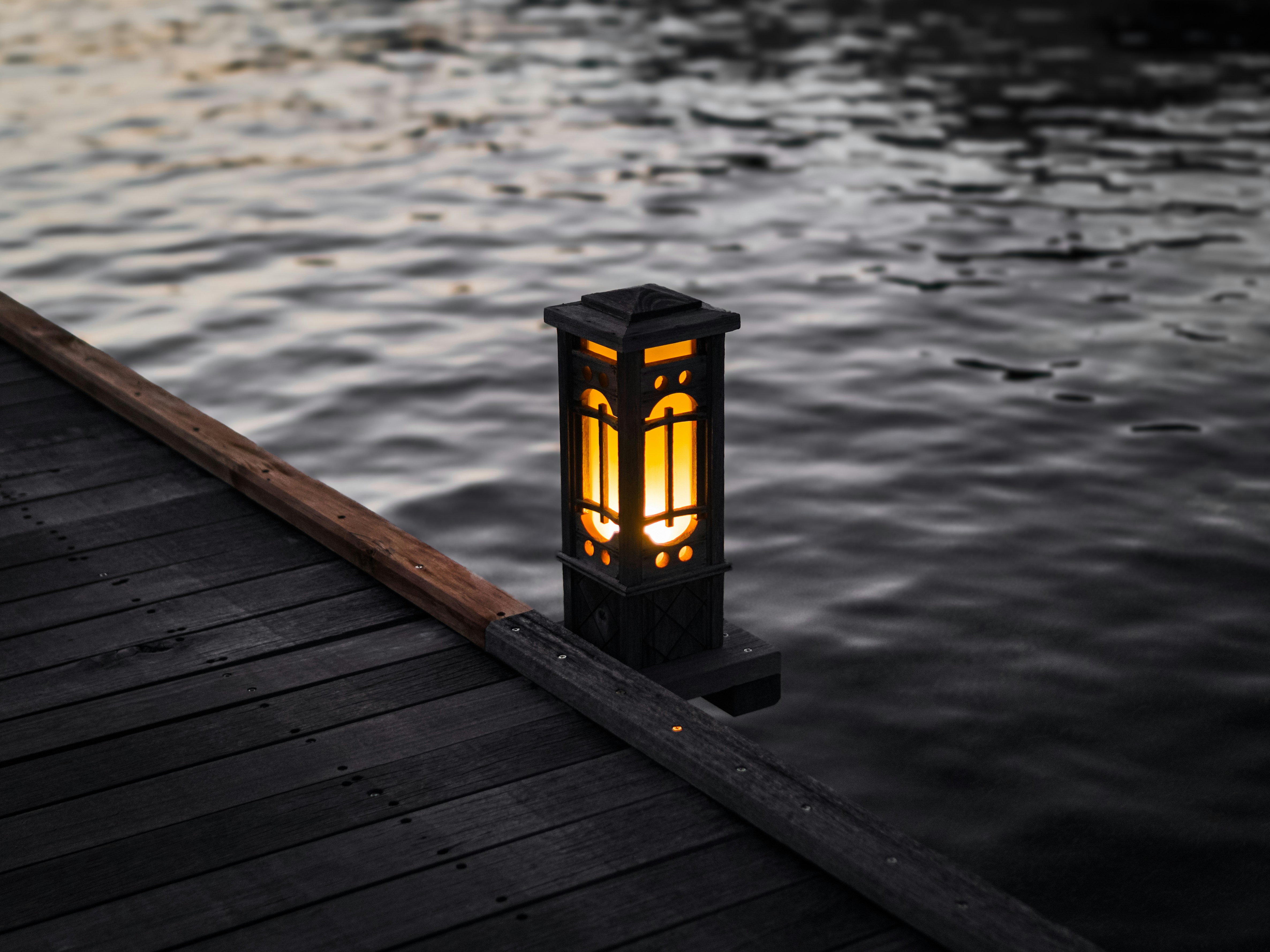 Lamp on a Quiet Dockside: Warm Glow by the Water